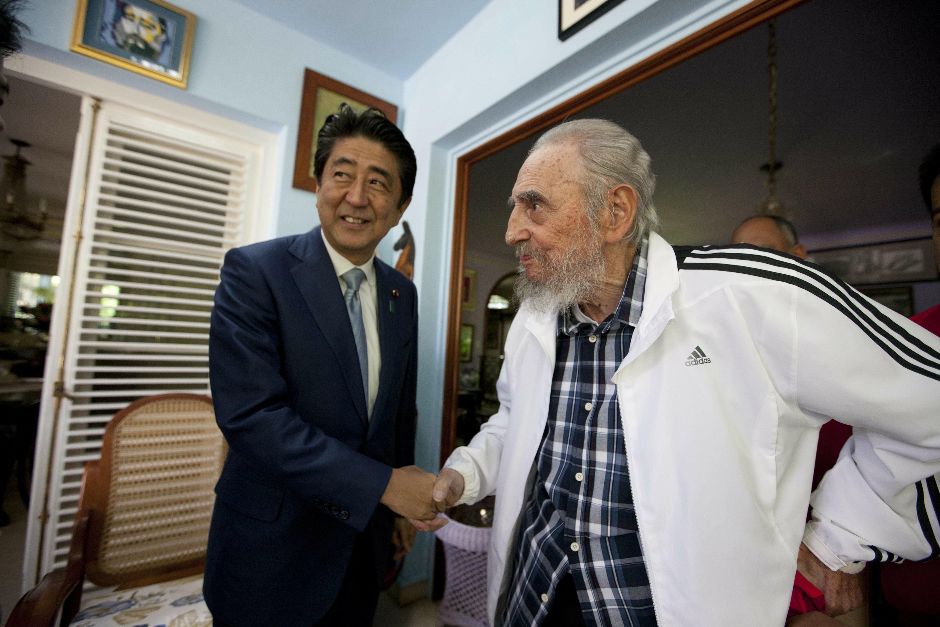 Japan PM meets with Castro brothers on Cuba visit | AP News