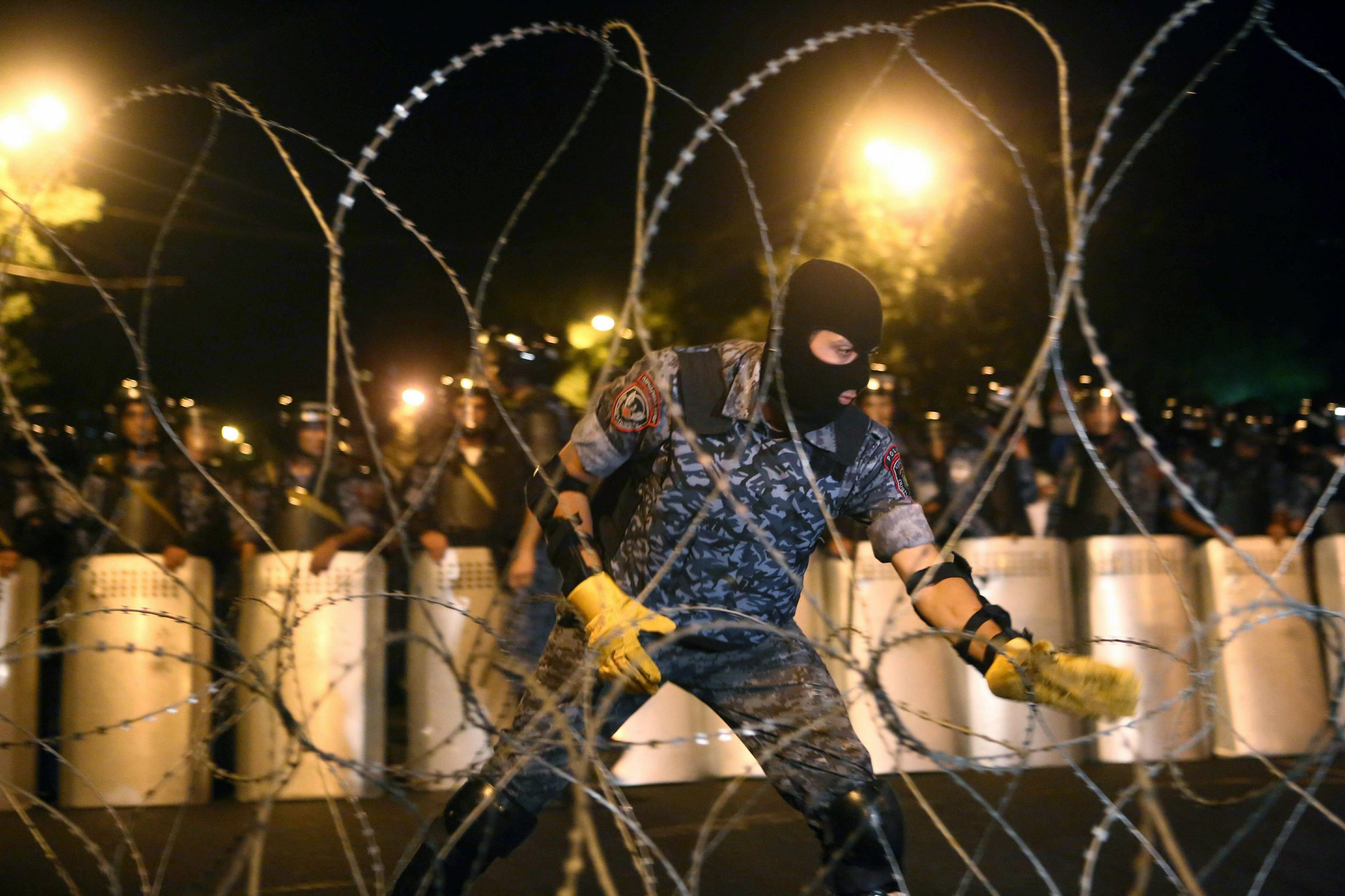 Armenia: 20 gunmen surrender, police station standoff over | AP News