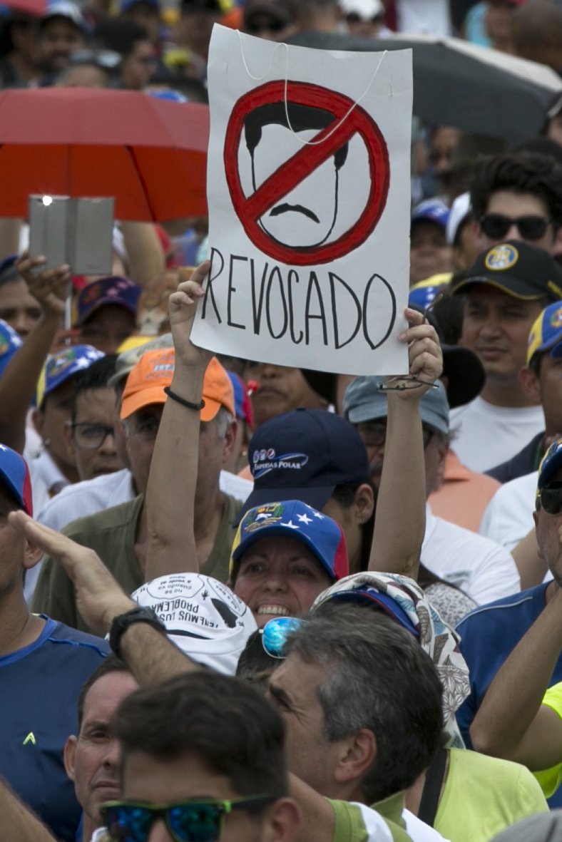 Mass protest in Venezuela demanding end of 'dictatorship' | AP News
