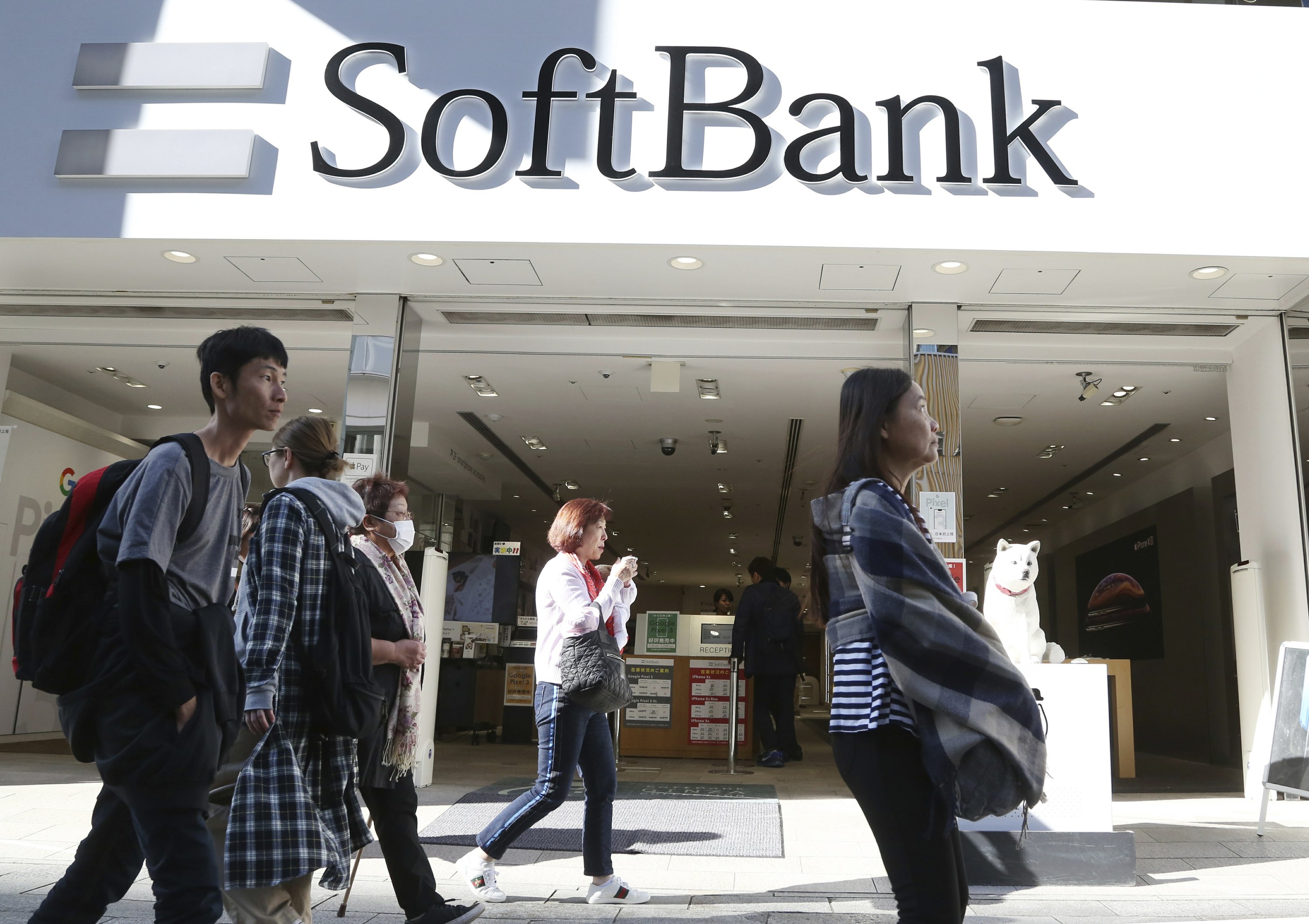 Japan's SoftBank invests in US office space-sharing WeWork | AP News