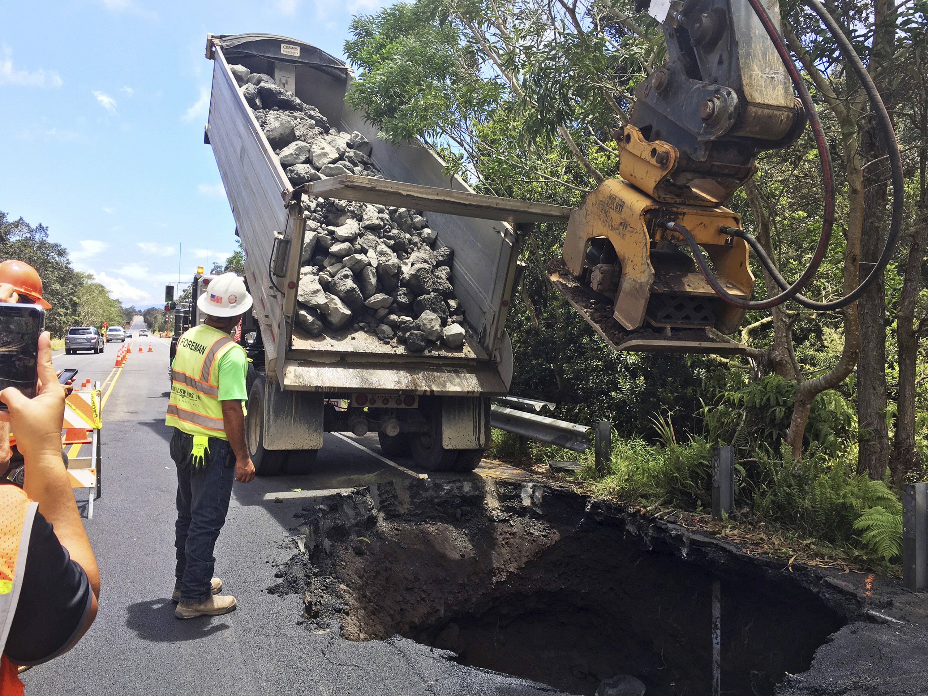 Road damage from earthquakes is latest Hawaii volcano peril | AP News