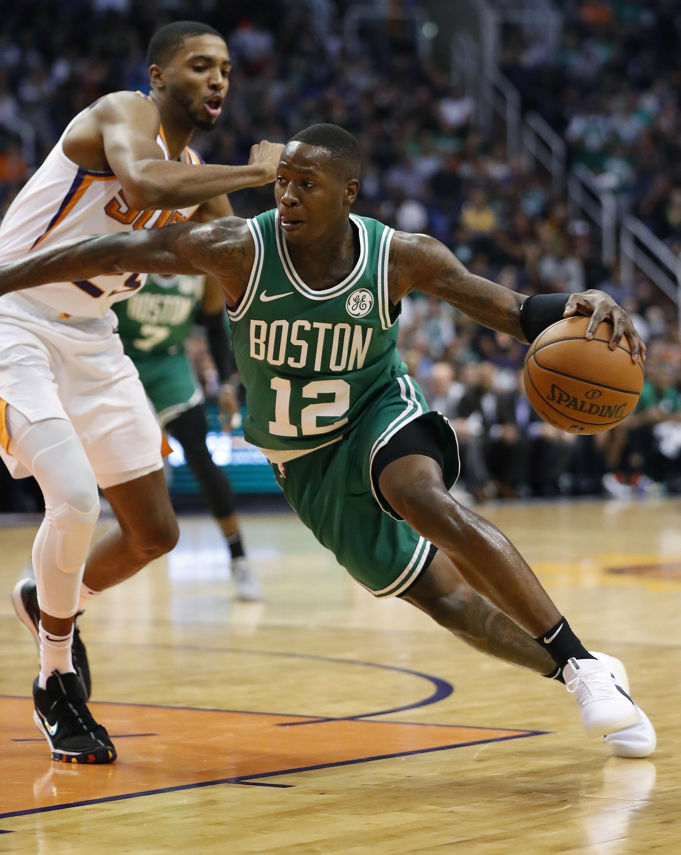 Irving, Celtics rally from 22 down to top Suns 116-109 in OT | AP News