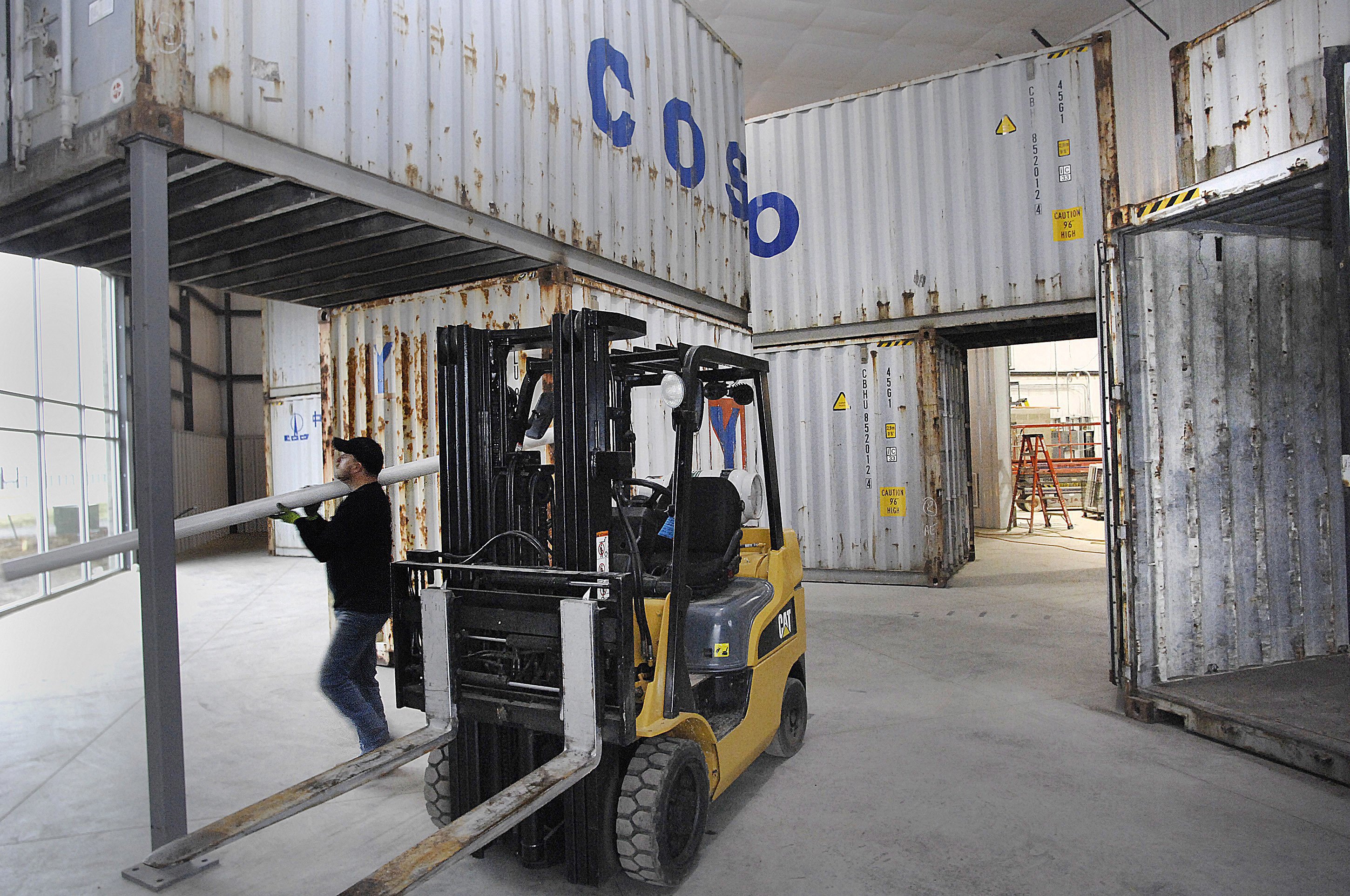 EXCHANGE: Containers to office space for firm's new home | AP News