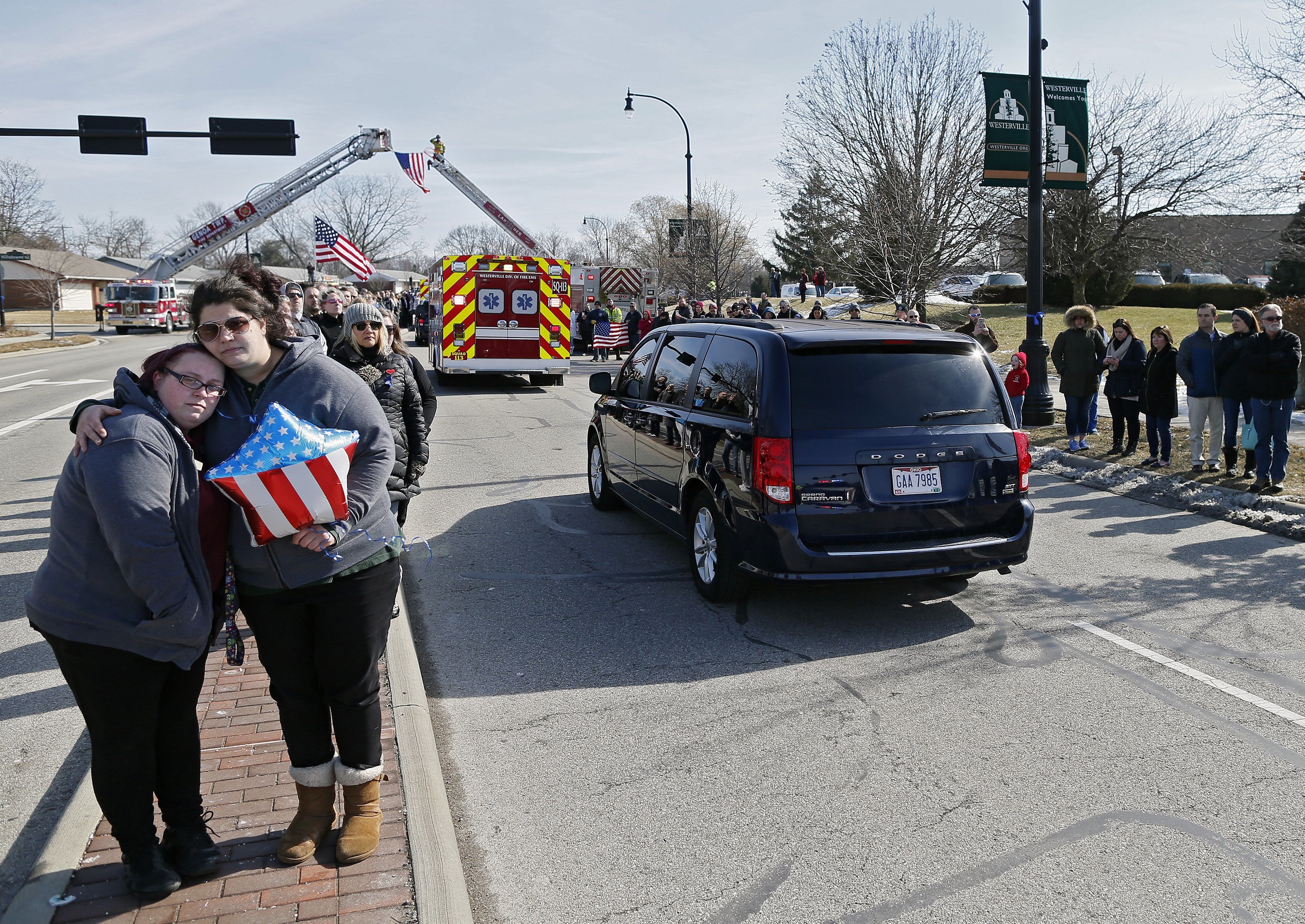 Funeral procession, services for Ohio officers fatally shot | AP News