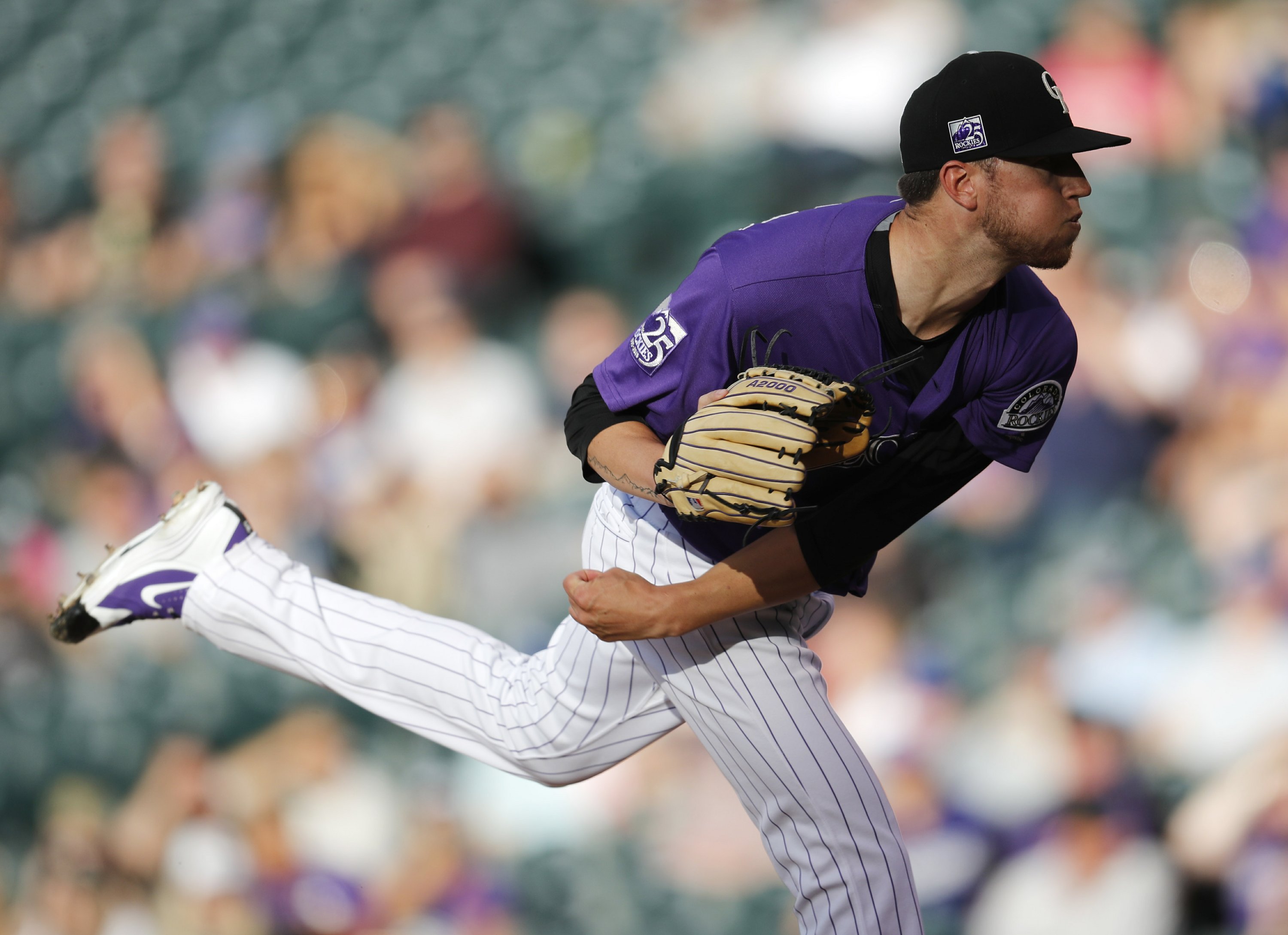 Giants lose 2 pitchers to injury in 11-4 loss to Rockies | AP News
