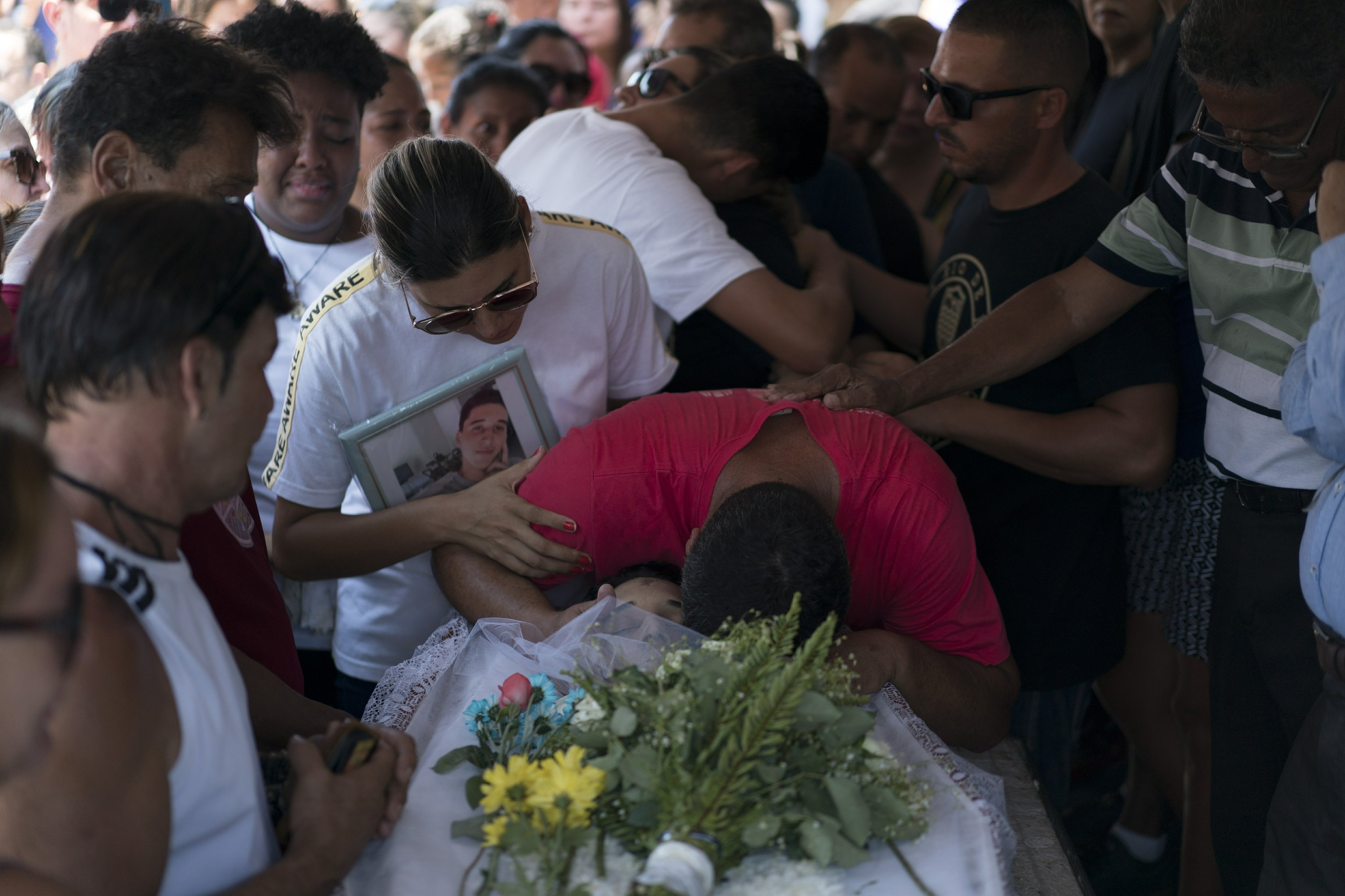 Fear and zeal over more guns in violence-plagued Brazil | AP News