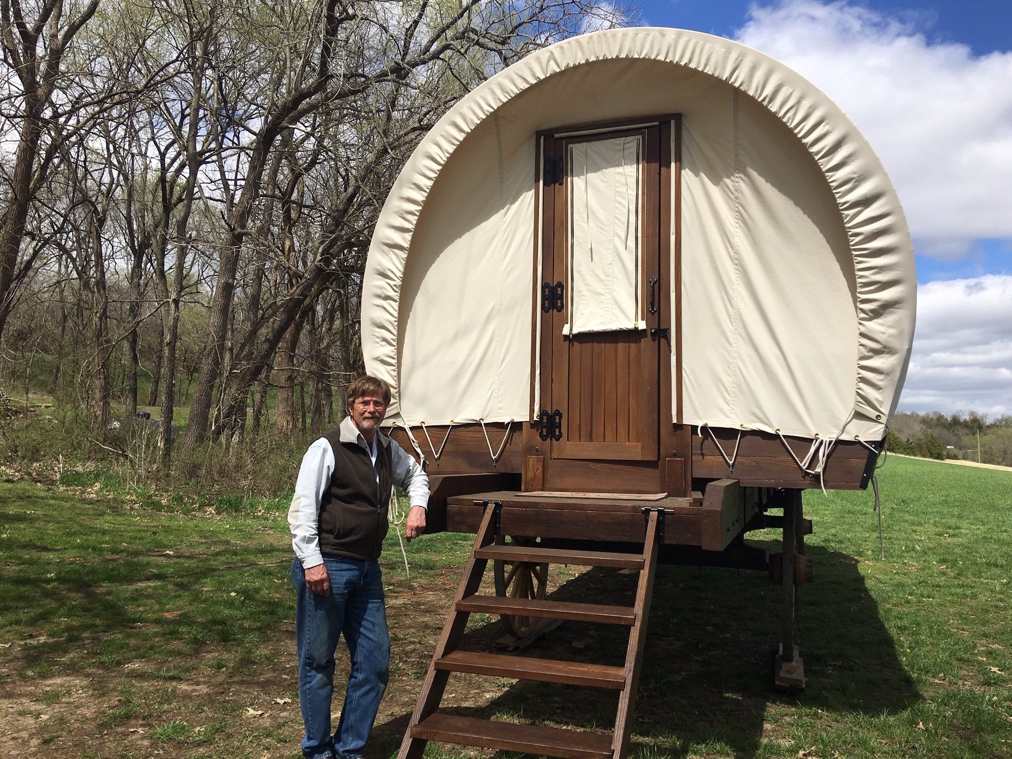 Kansas couple designs covered wagons for 'glamping' | AP News