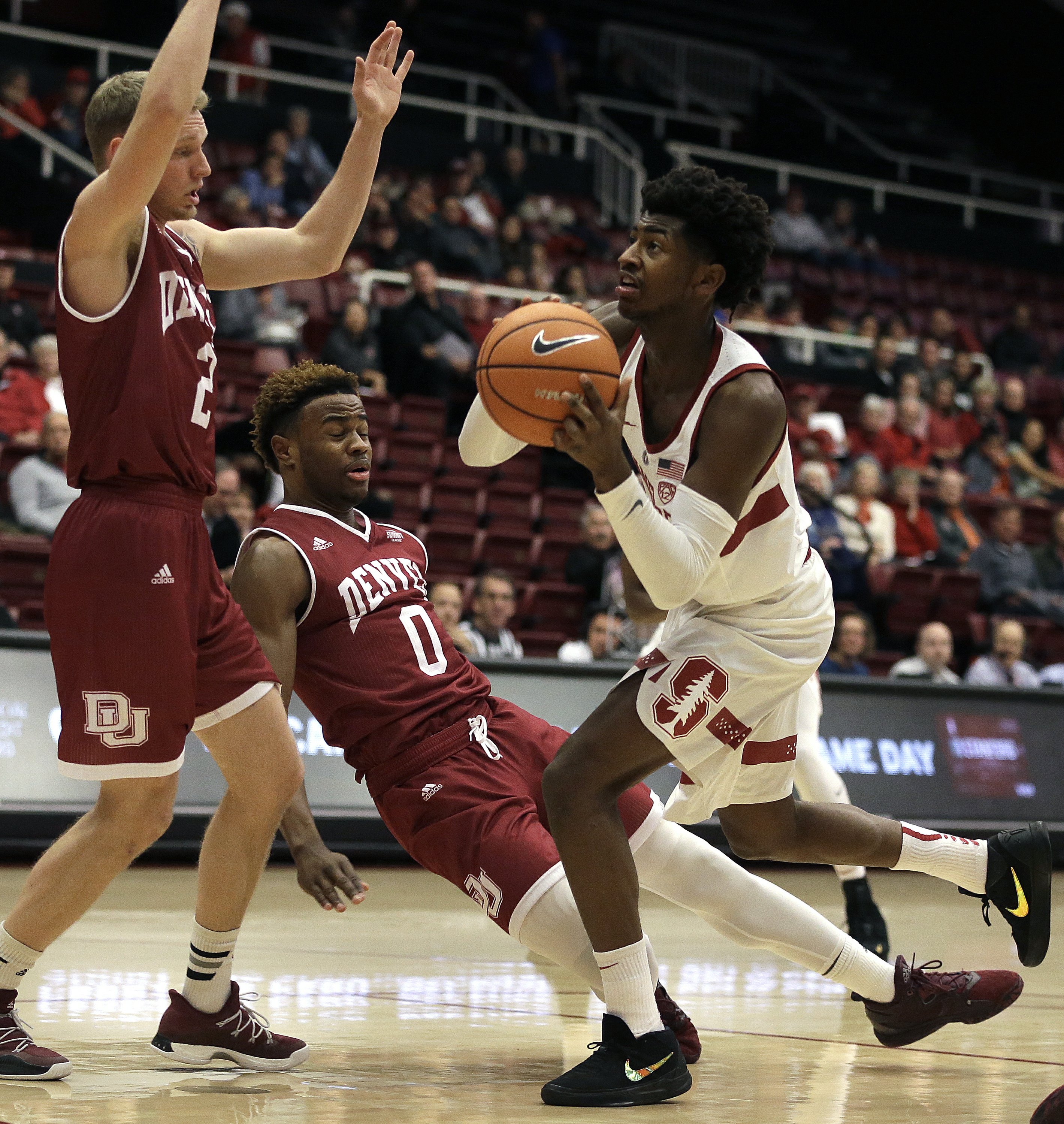 Travis, Davis each score 20 in Stanford's win over Denver | AP News