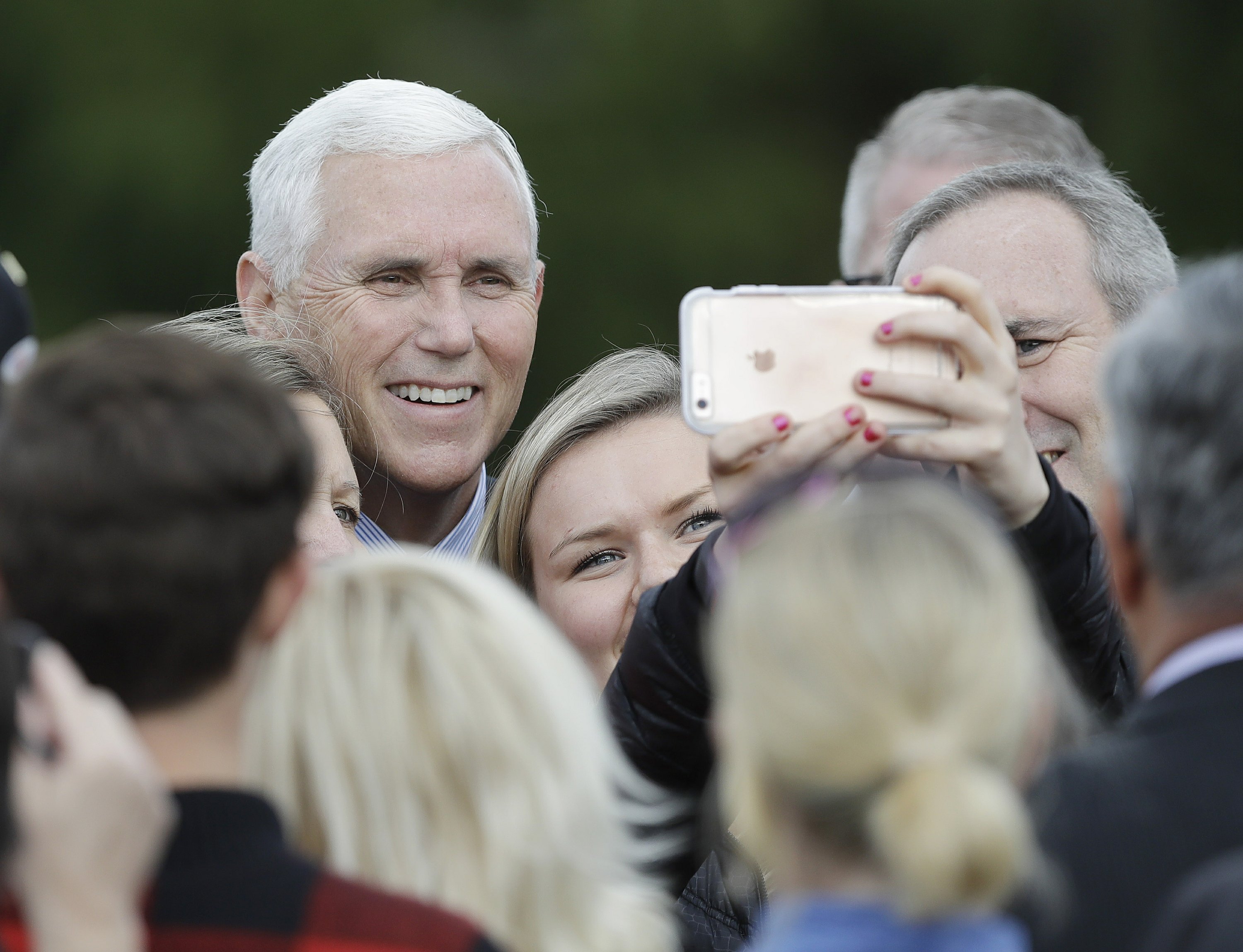 Trump shakes up transition team, elevates Pence's role | AP News