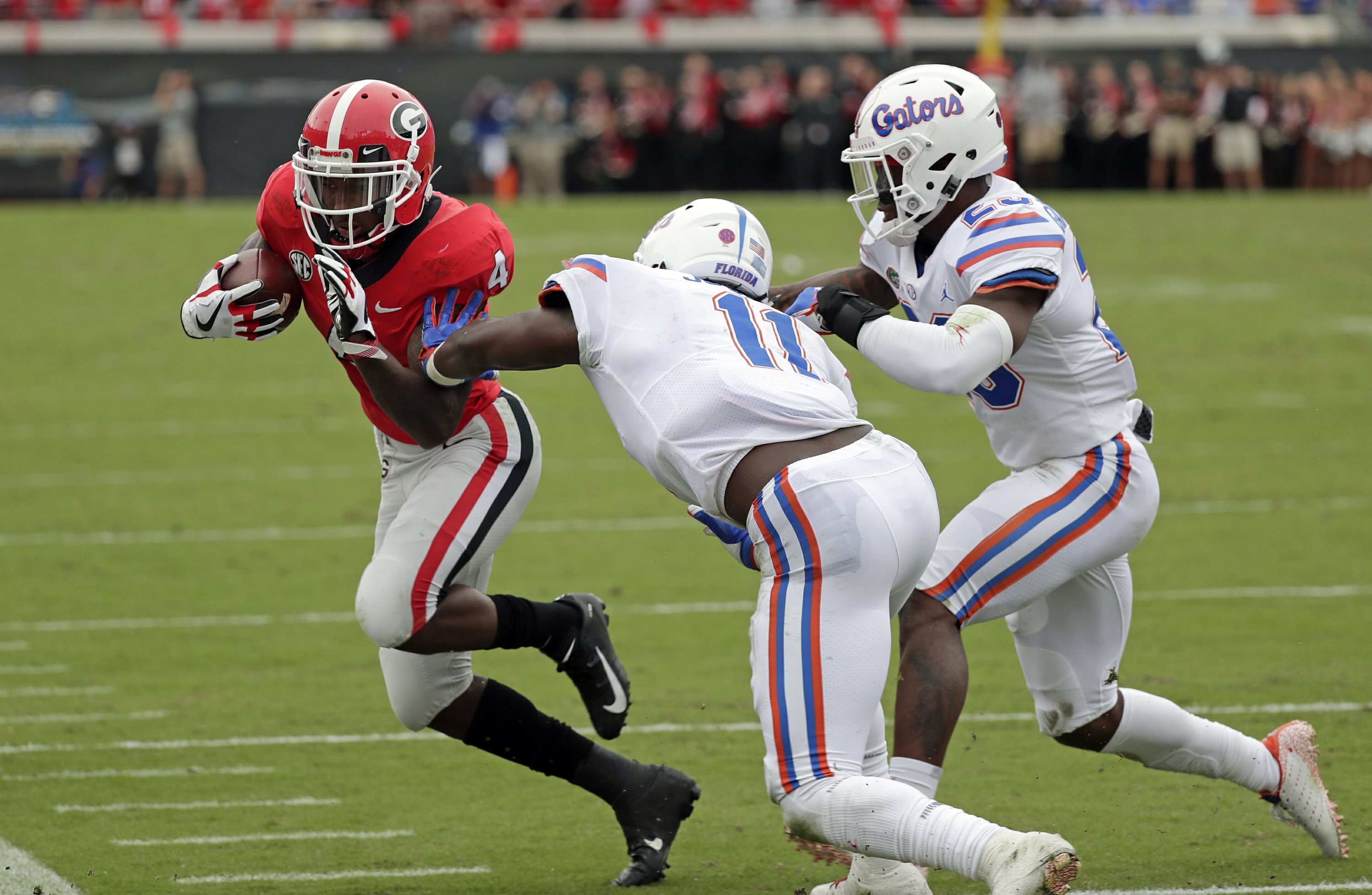 Fromm throws 3 TDs, No. 7 Georgia beats No. 9 Florida 36-17 | AP News