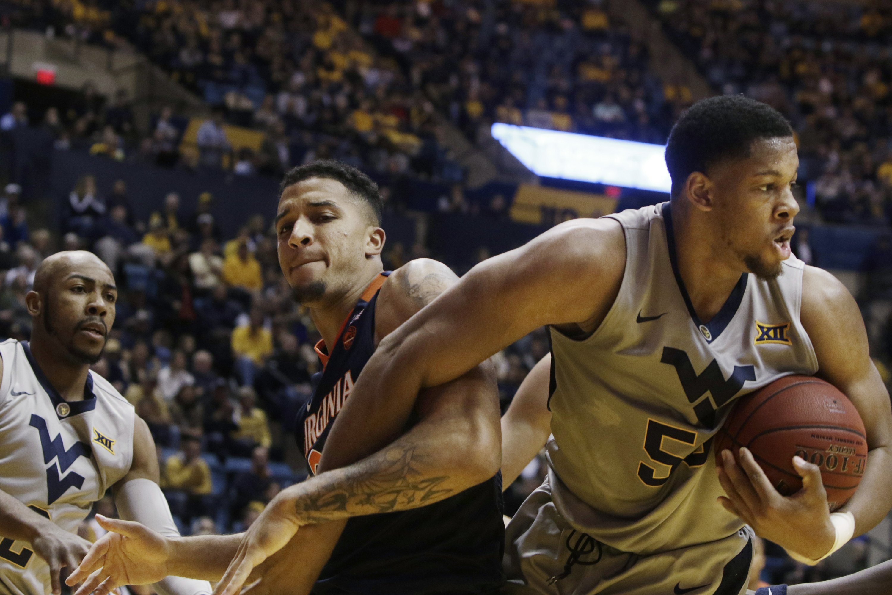 Carter, West lead No. 18 WVU over No. 15 Virginia 68-61 | AP News