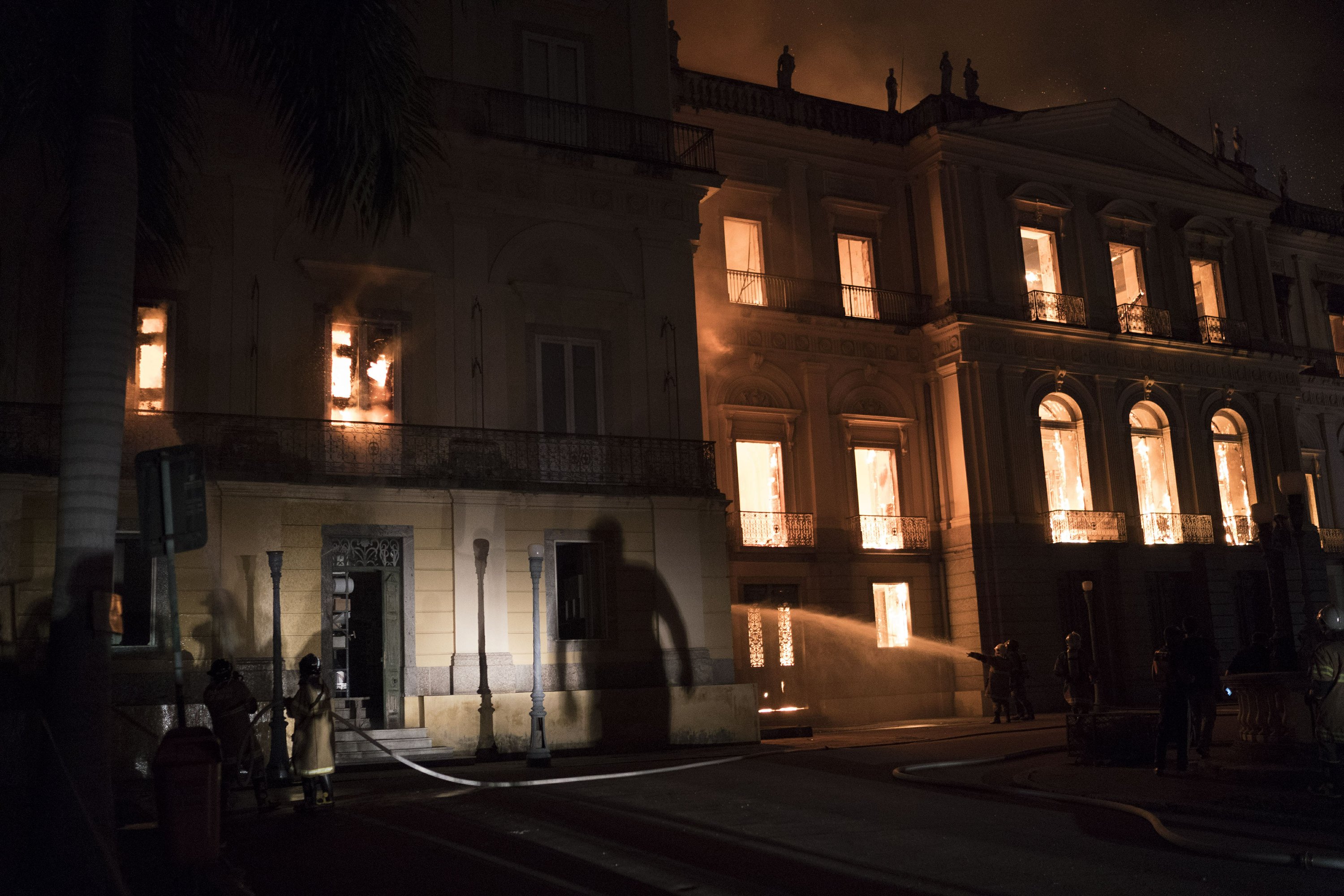 Firefighters try to save relics as fire engulfs Rio museum | AP News