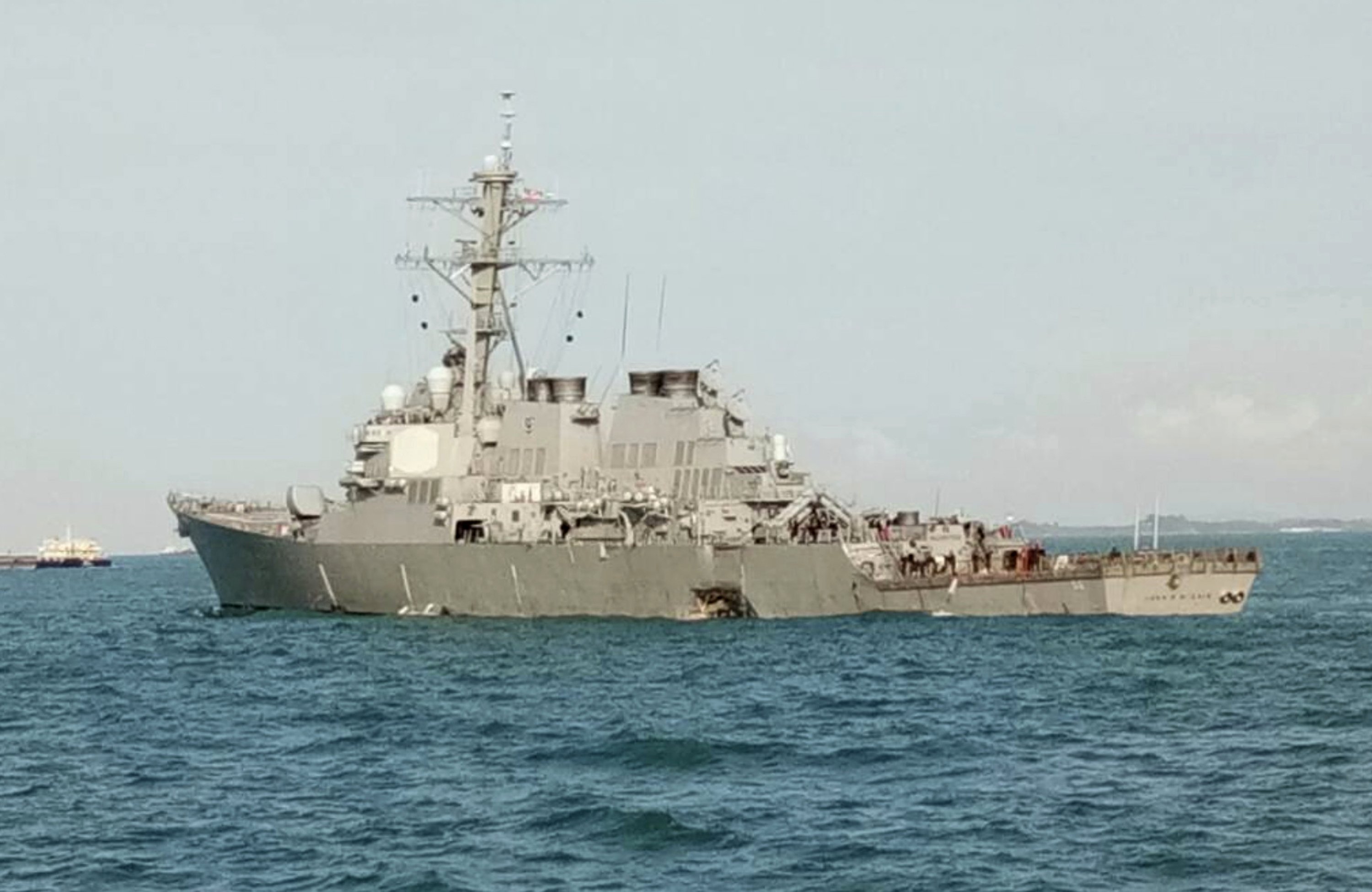 10 sailors missing in collision between US warship, tanker | AP News