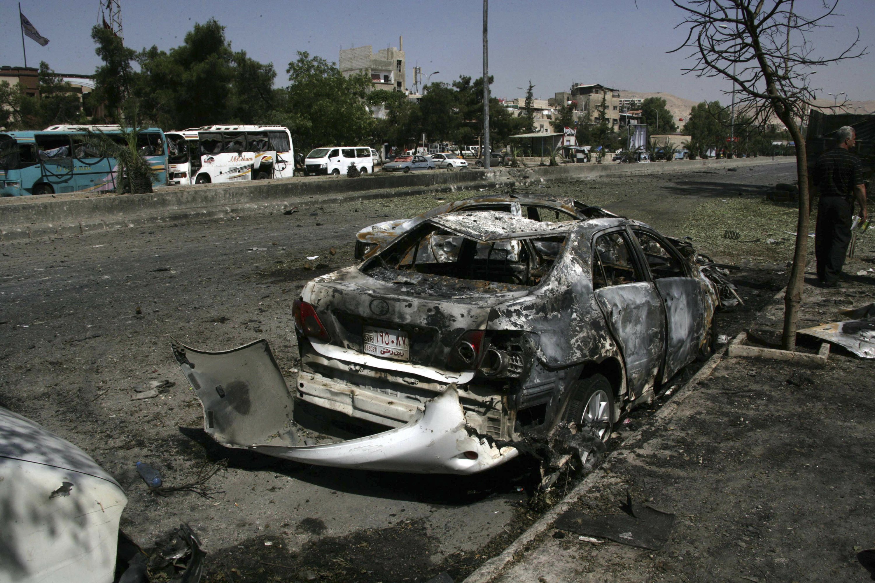 The Latest: Bashar Assad face of new Syria bank note | AP News