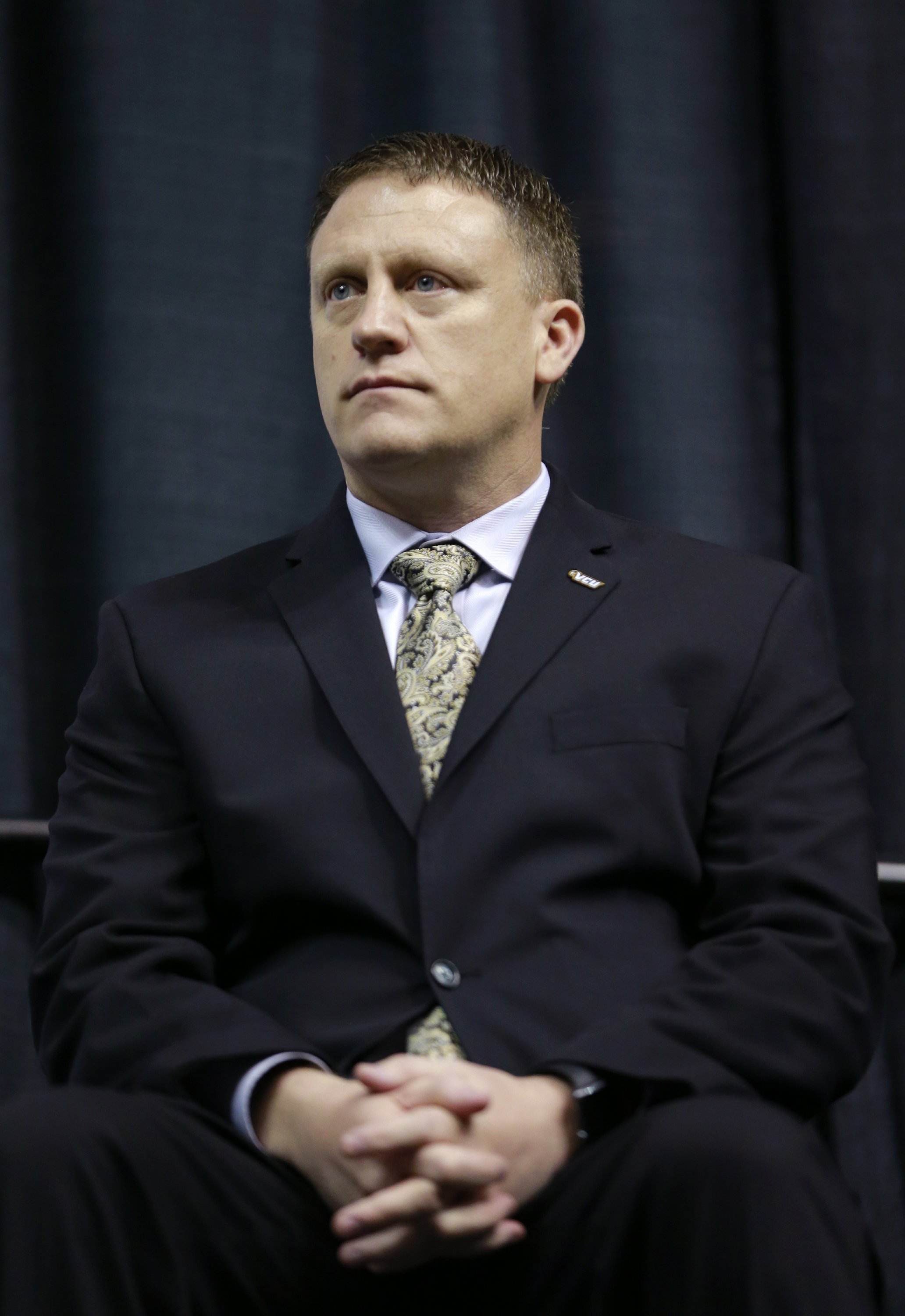 VCU welcomes Rhoades back, he says career ride 'stops here' | AP News