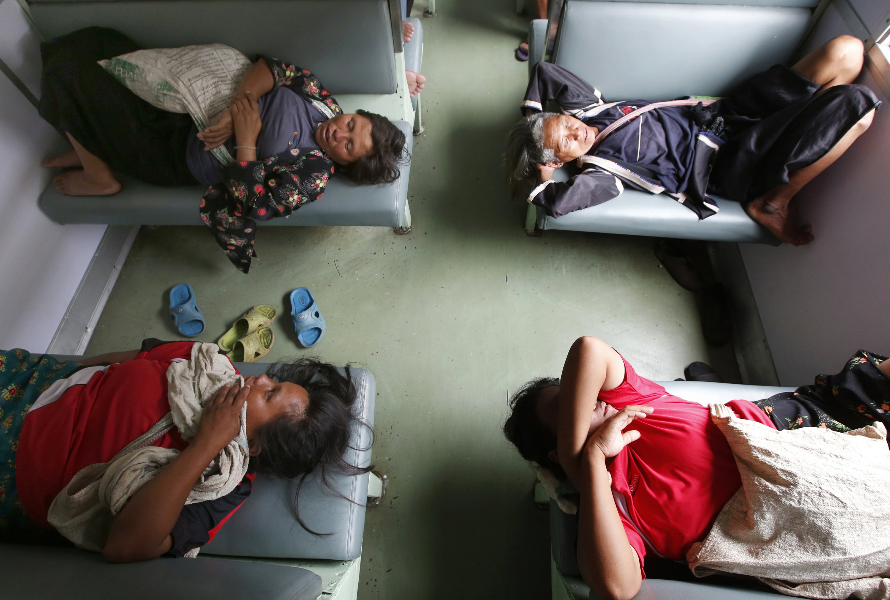 Image of Asia: Passengers sleep on Bangkok train | AP News