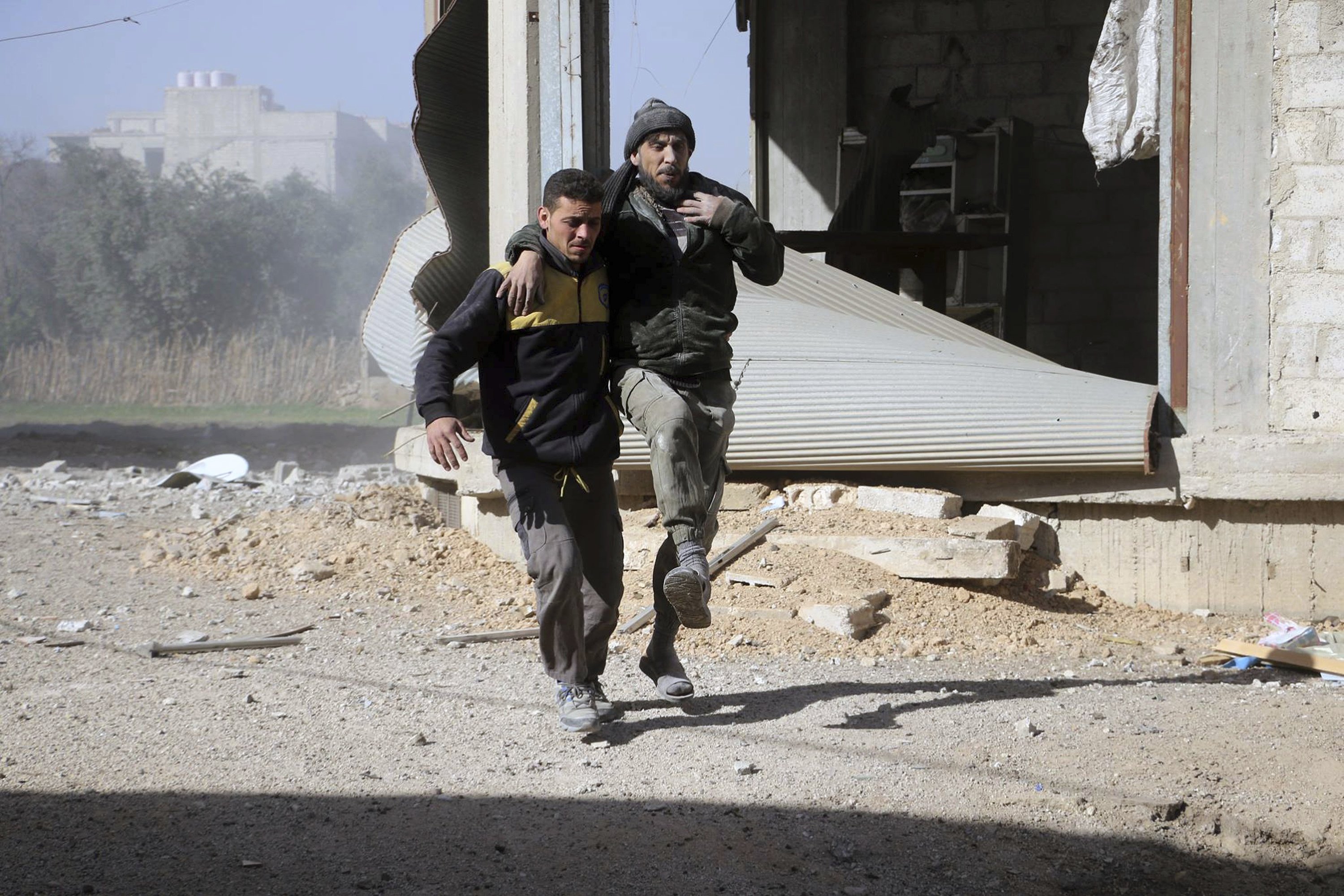 Reports: Syrian troops split rebel-held enclave near capital | AP News