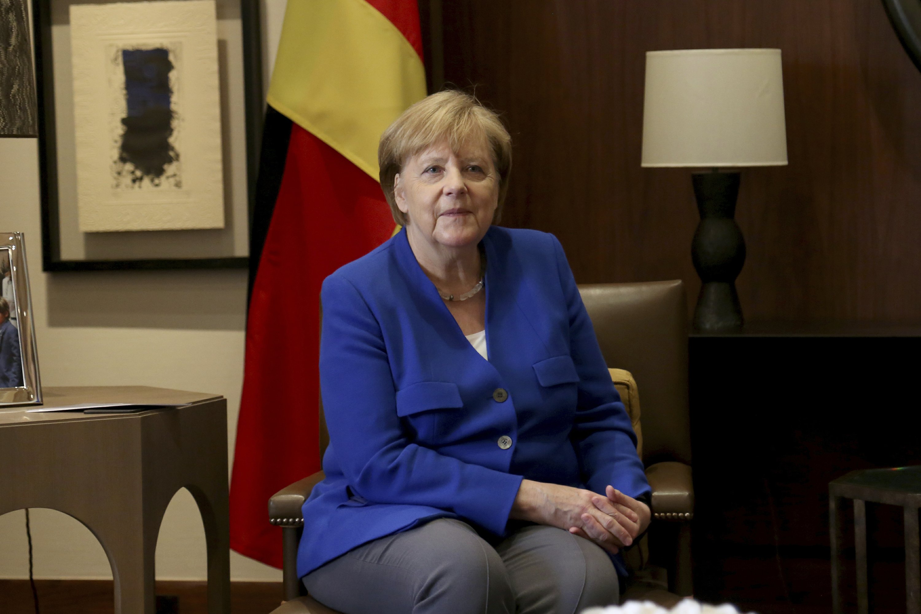 German EU commissioner warns Merkel allies in migration spat | AP News