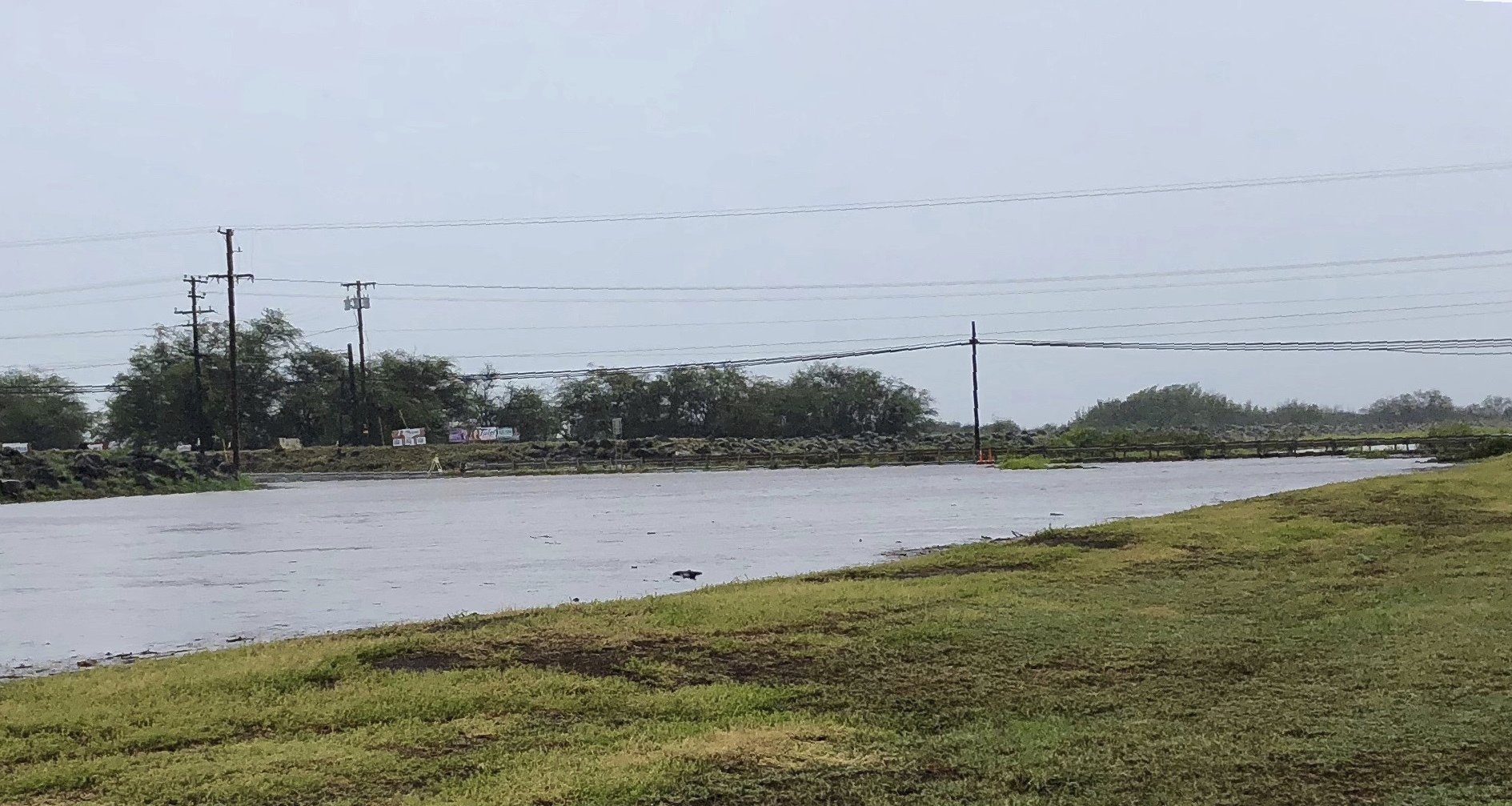 Tropical storm fades but still douses Hawaii with rain | AP News