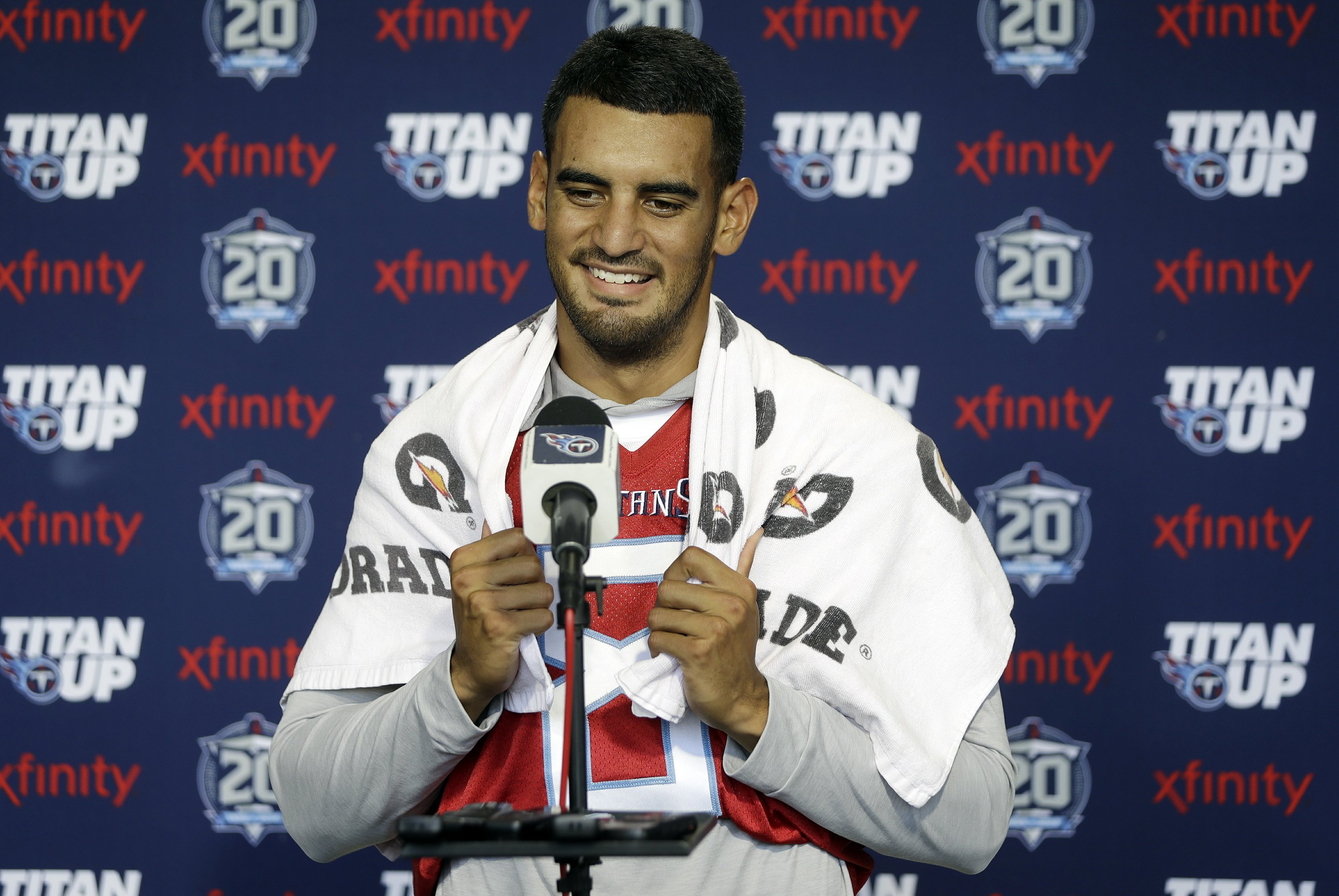 Marcus Mariota running fast learning Titans' latest offense | AP News