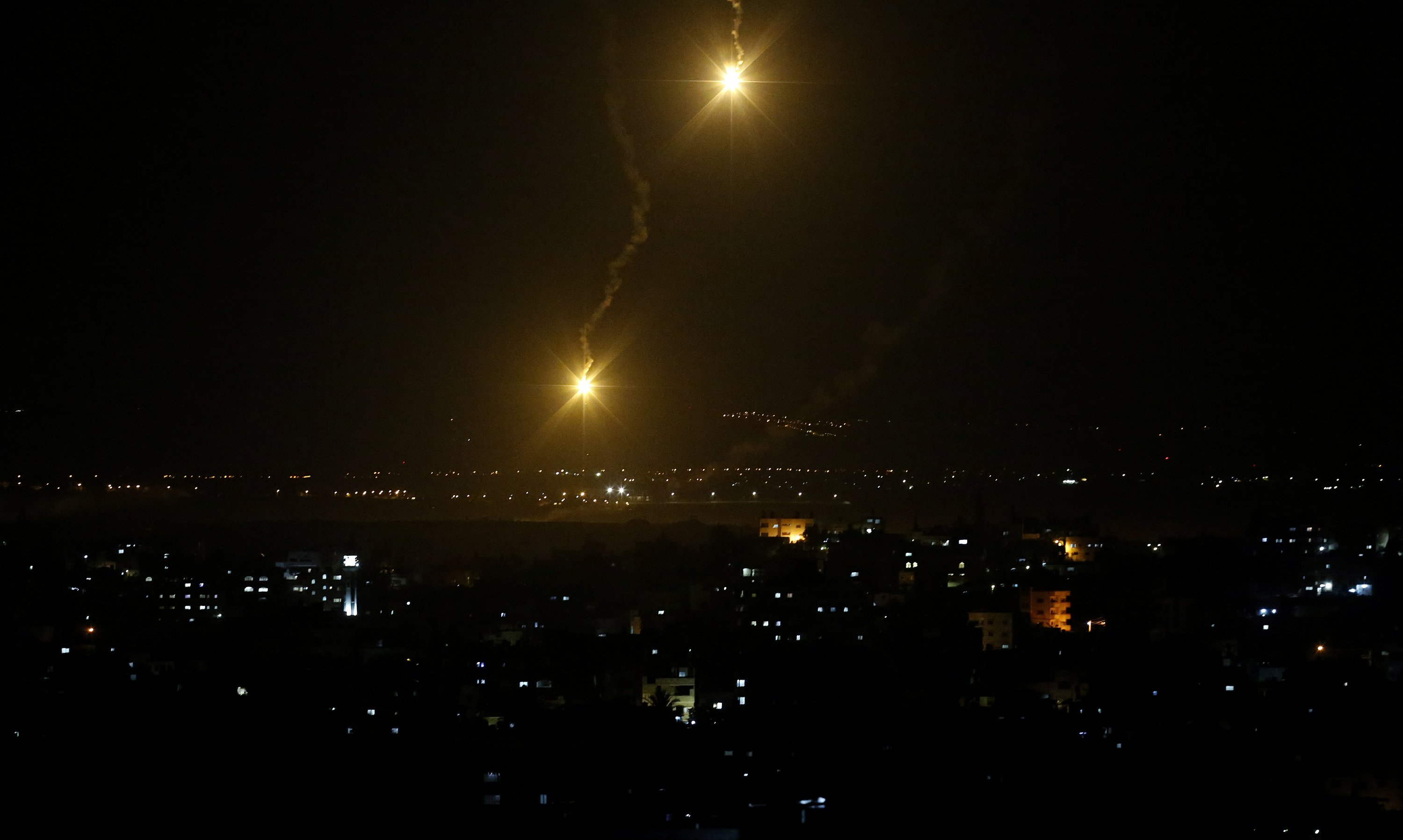 Israel, Hamas trade heavy fire after deadly incursion | AP News