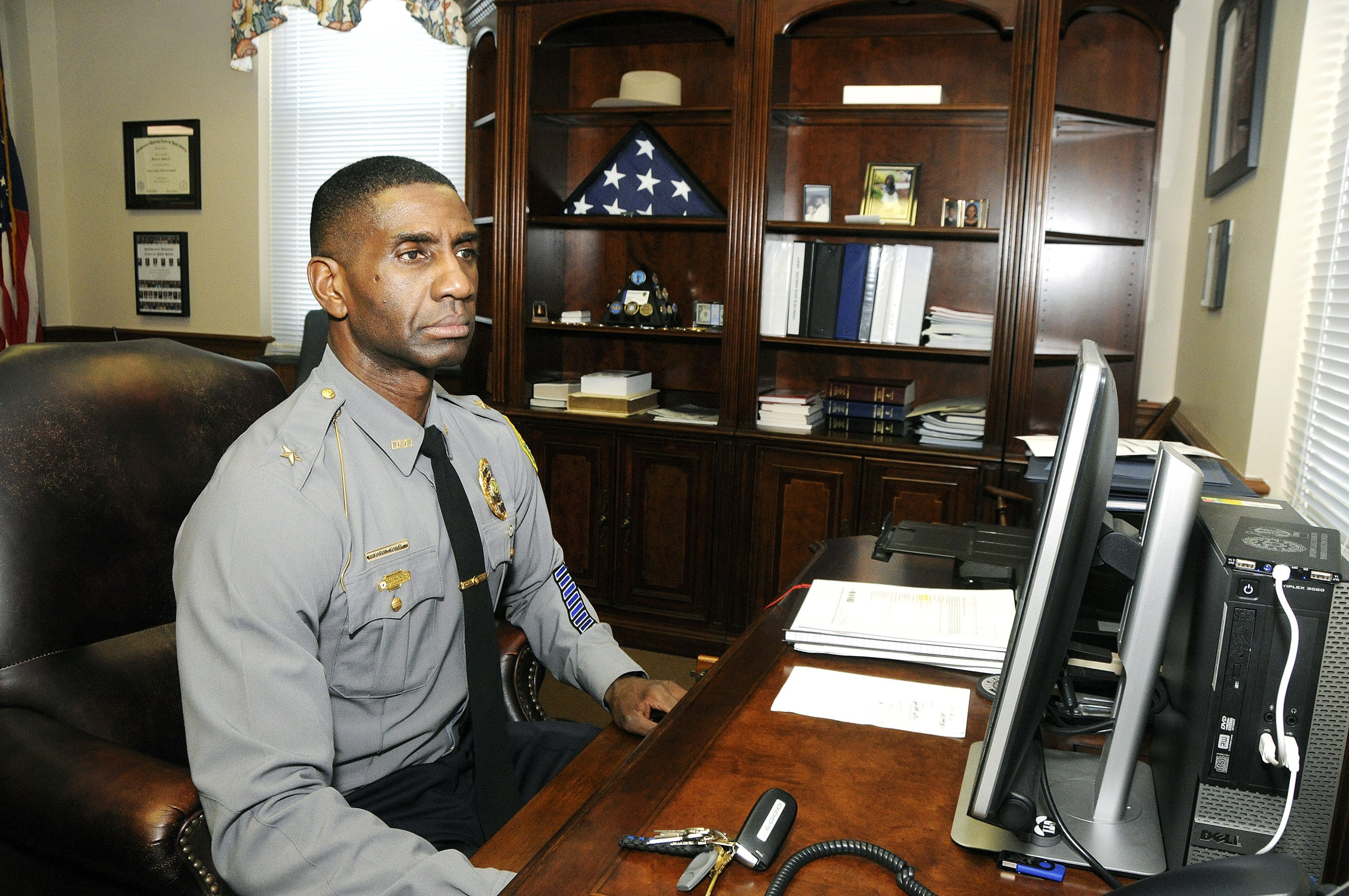 Dover police chief breaks barriers as city's 1st black chief | AP News