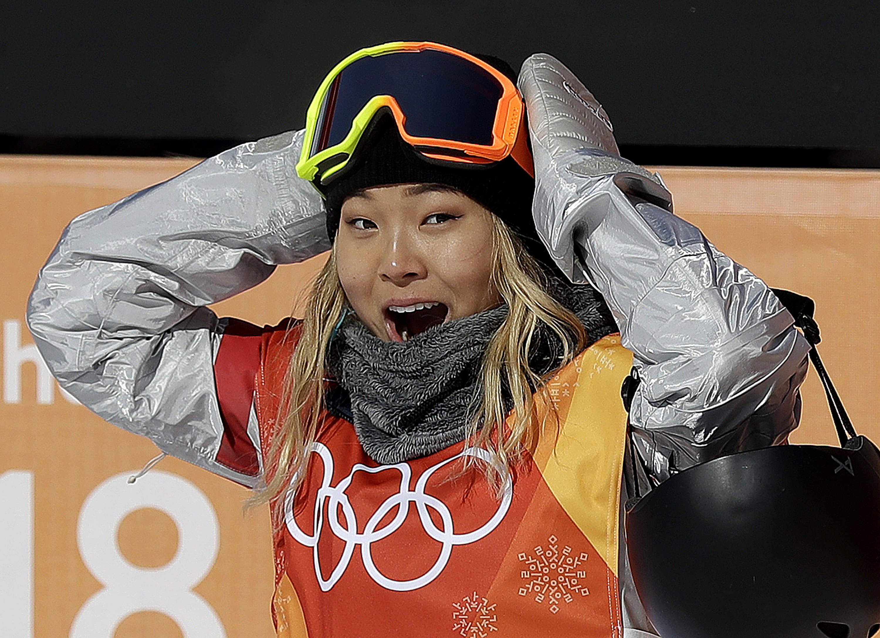 Victory lap: Chloe Kim takes her family on a gold-medal ride | AP News