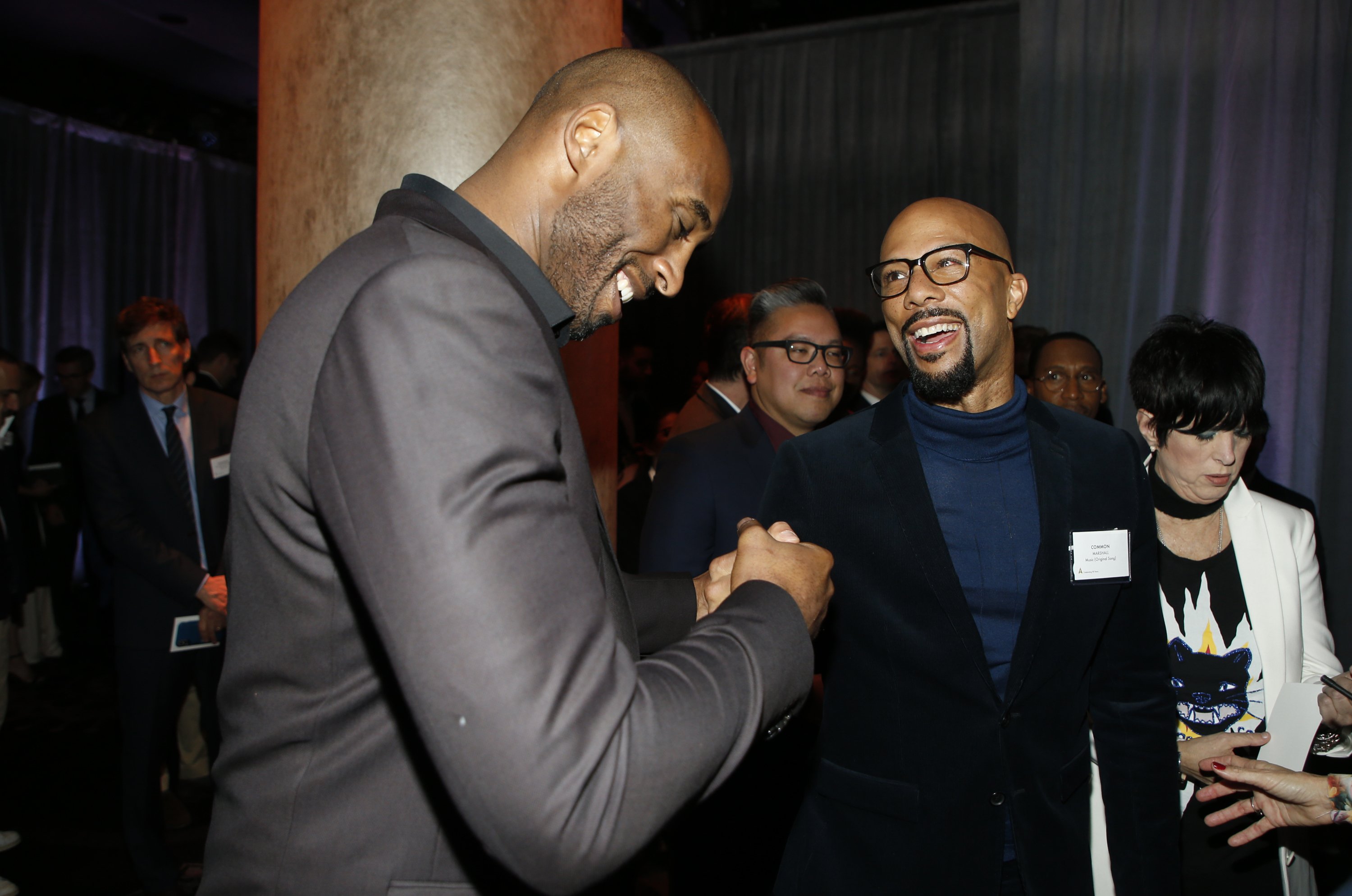 High Fives and a black eye: Scenes from Oscar Nominees Lunch | AP News
