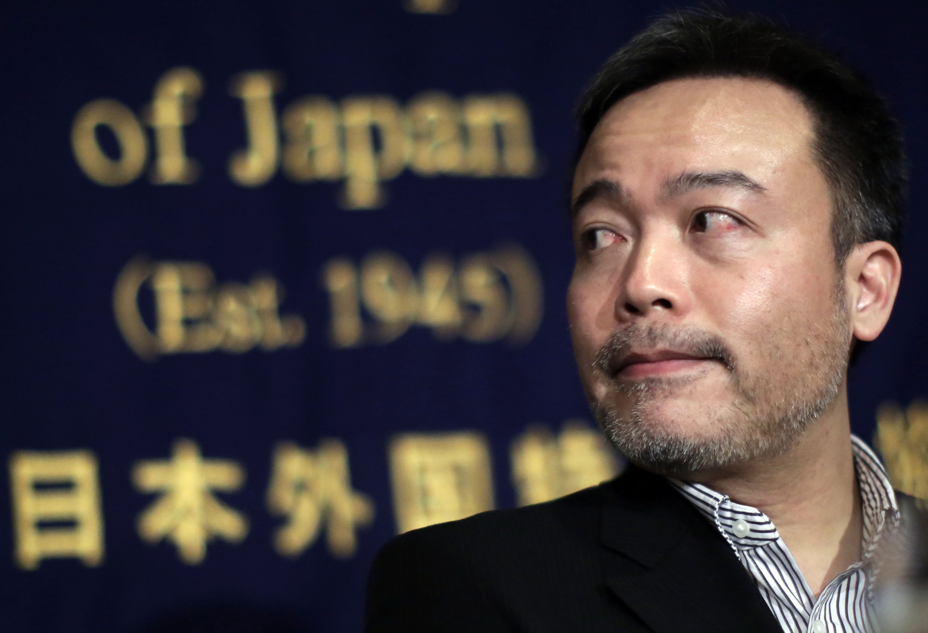 Japan reporter sues government after passport is invalidated | AP News