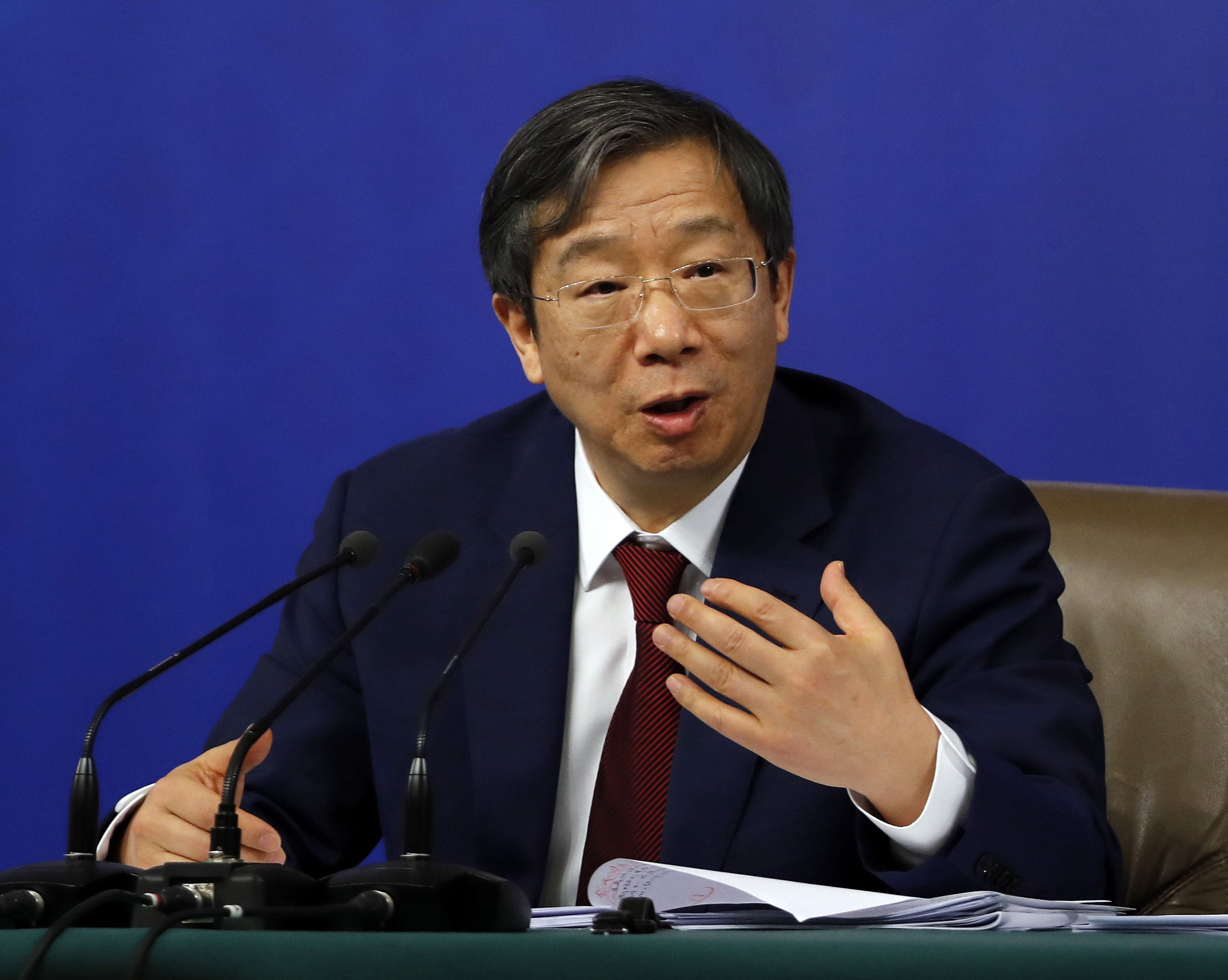 China's new central banker pledges to rein in financial risk | AP News