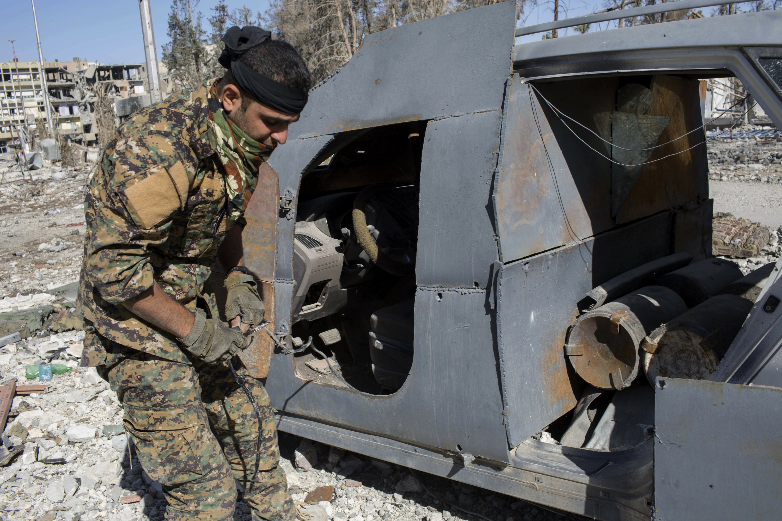 US-backed Syrian forces clear Raqqa after driving out IS | AP News