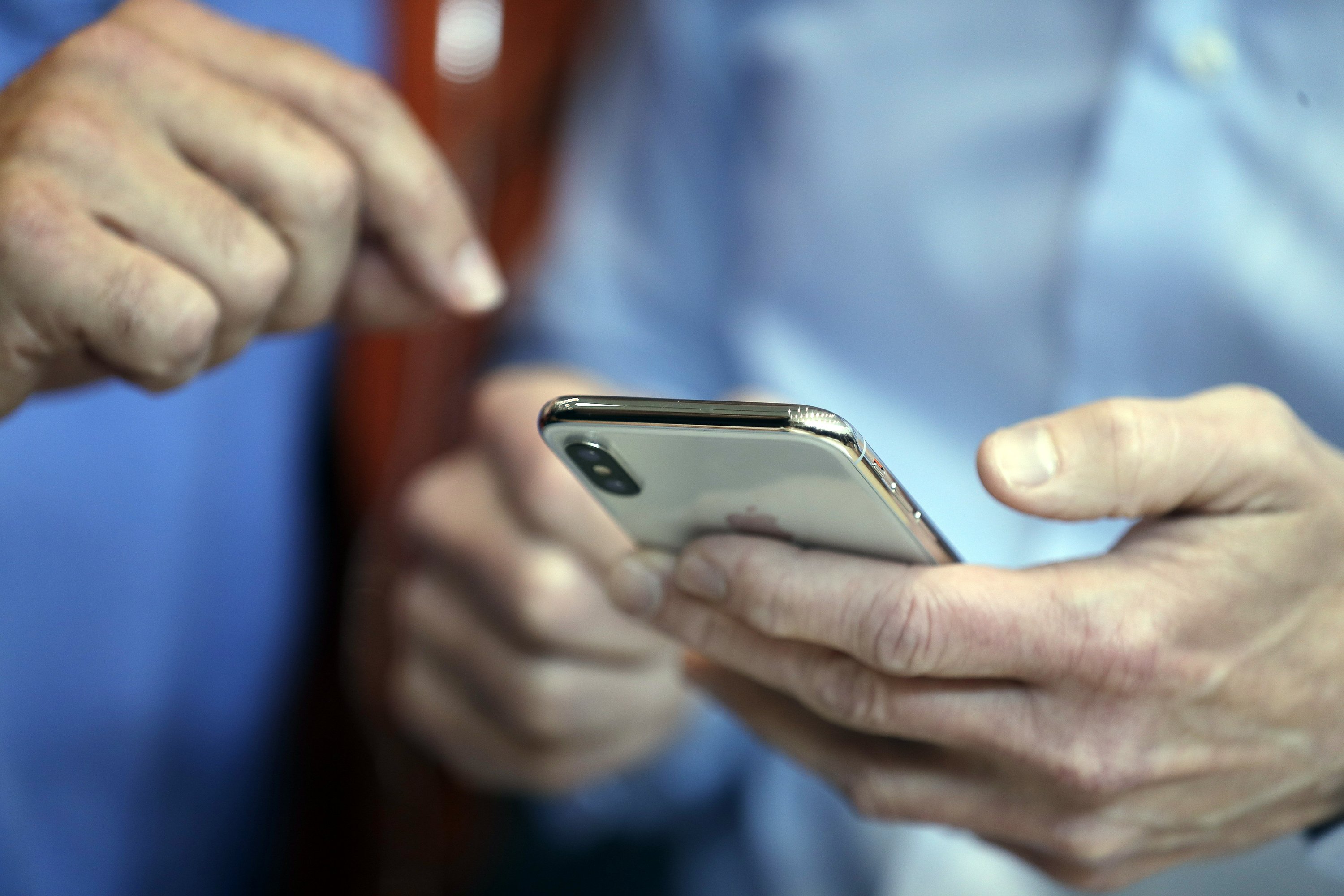 First look: Apple's luxury iPhone both copies and innovates | AP News