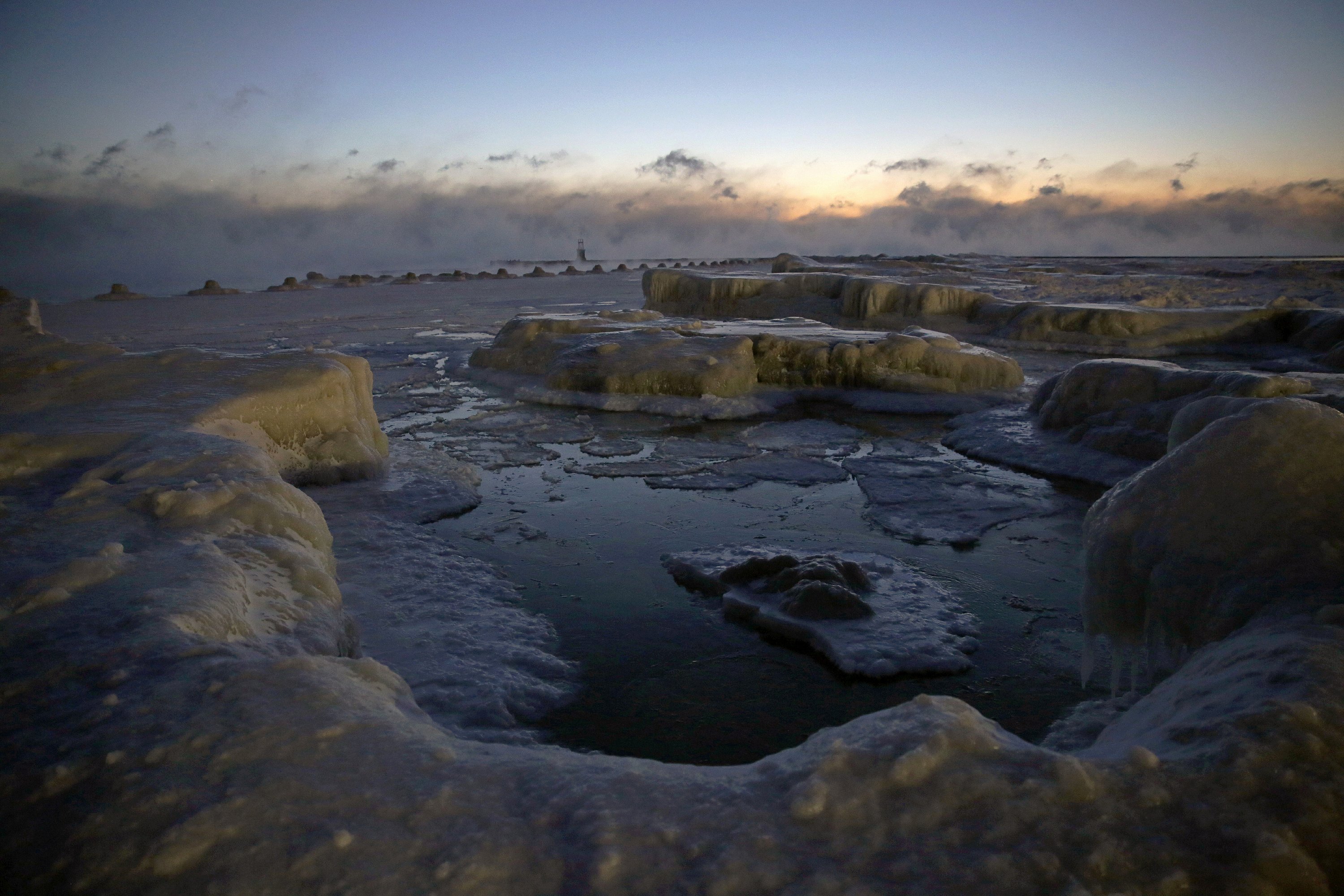 Bitter cold breaks daily temperature records across Illinois | AP News