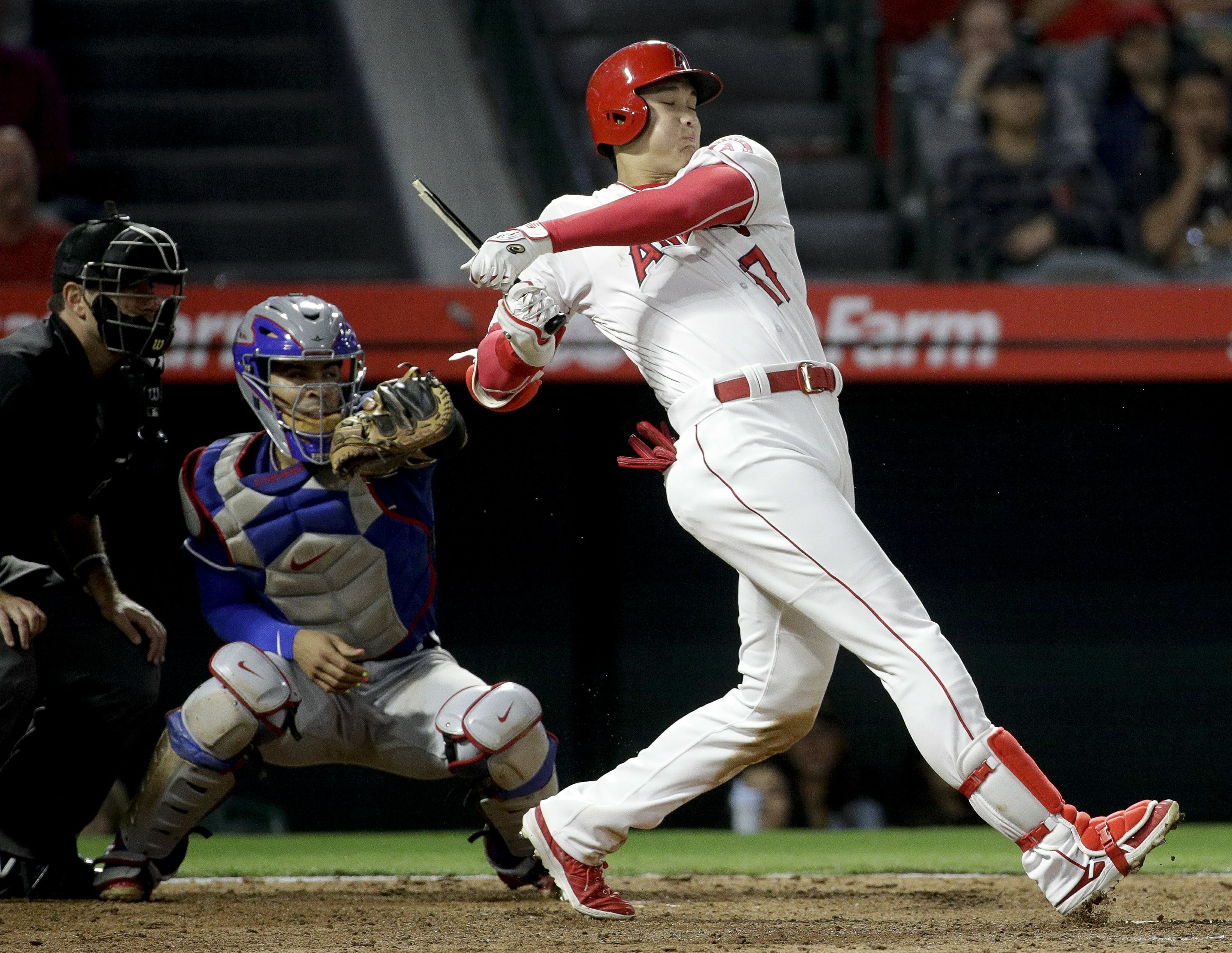 Angels rally with four in sixth, top Rangers 4-1 | AP News