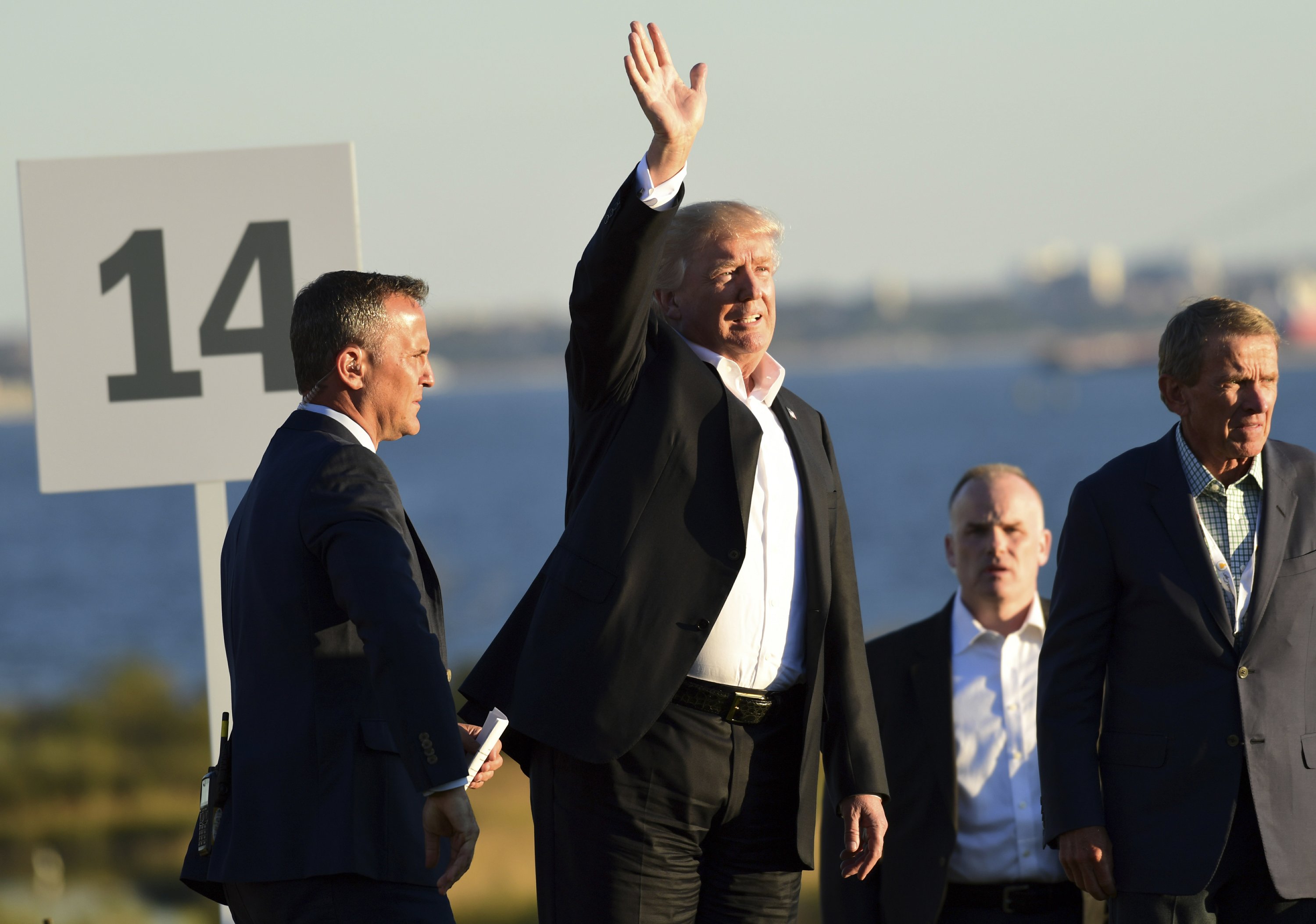 The Latest: Trump dedicates golf trophy to hurricane victims | AP News