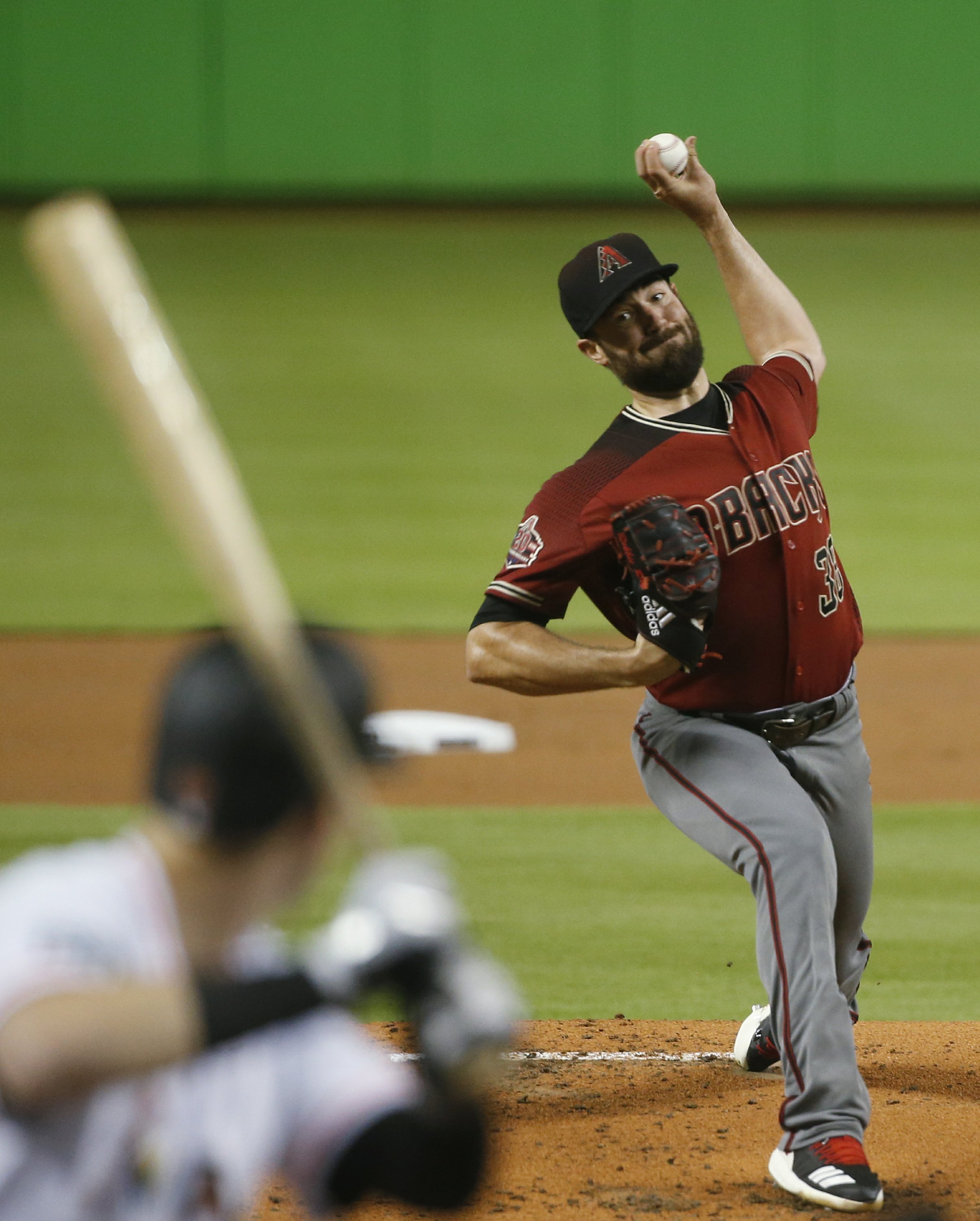 Ray sharp in return as Diamondbacks beat Marlins 2-1 | AP News