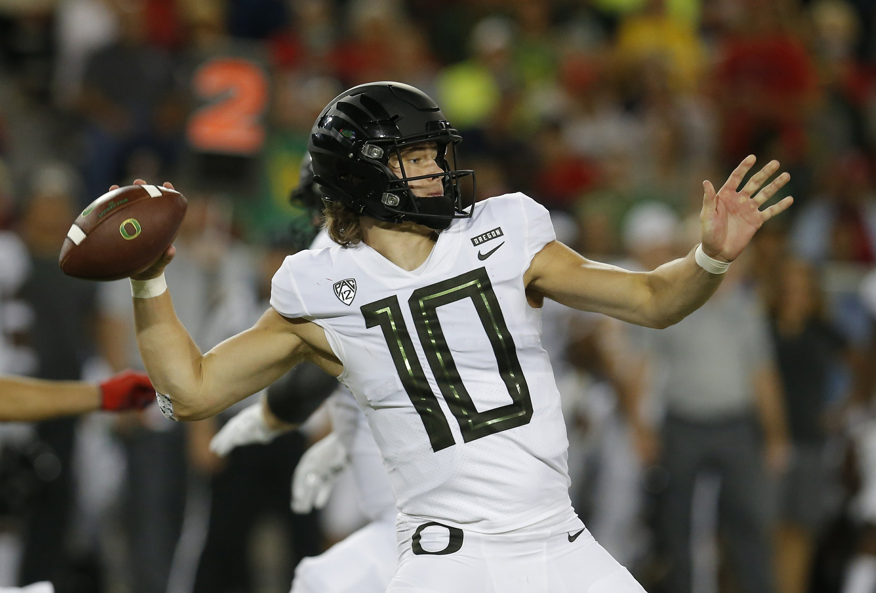 Justin Herbert gives Ducks some continuity amid new faces | AP News
