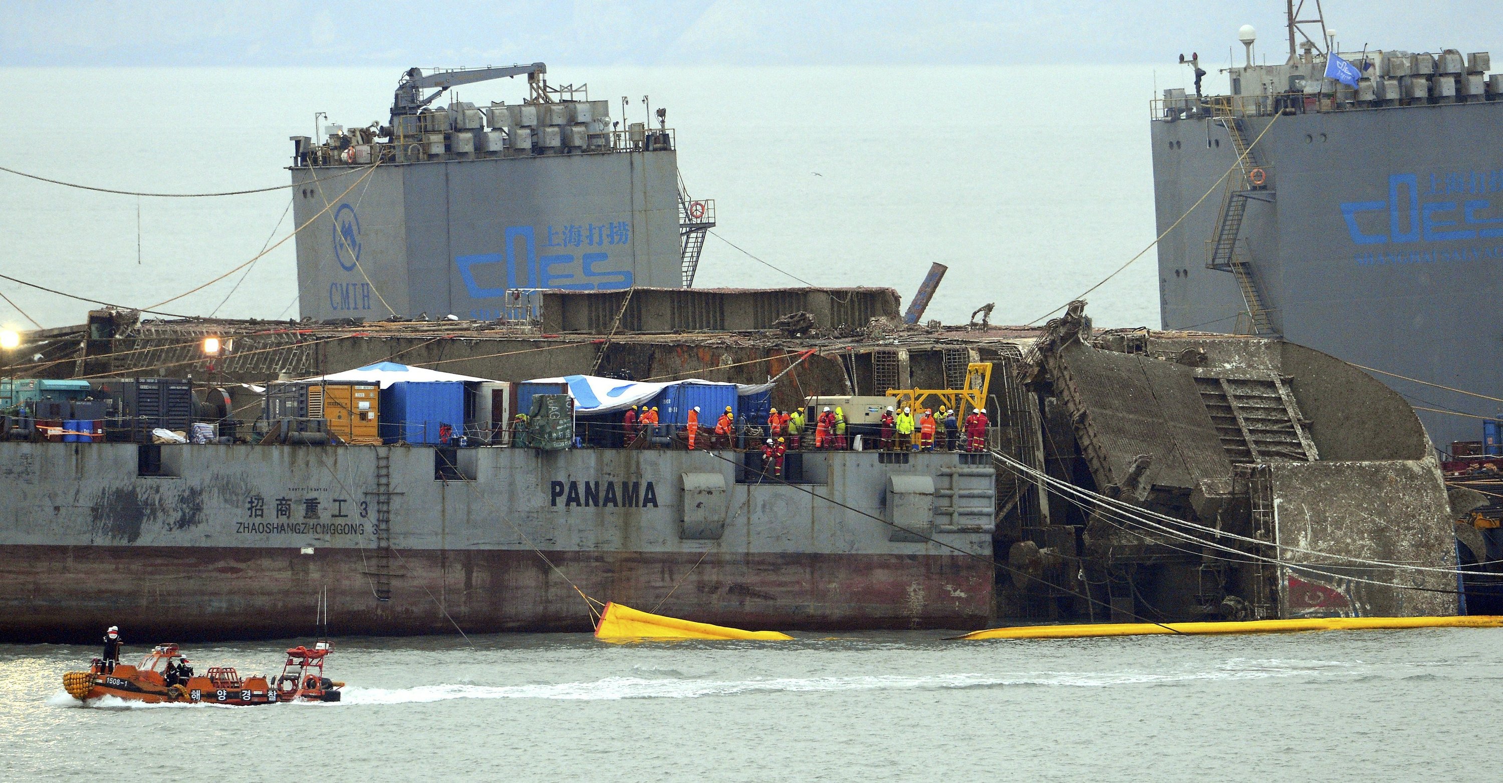 Sunken S.Korean ferry set to be loaded on transport vessel | AP News