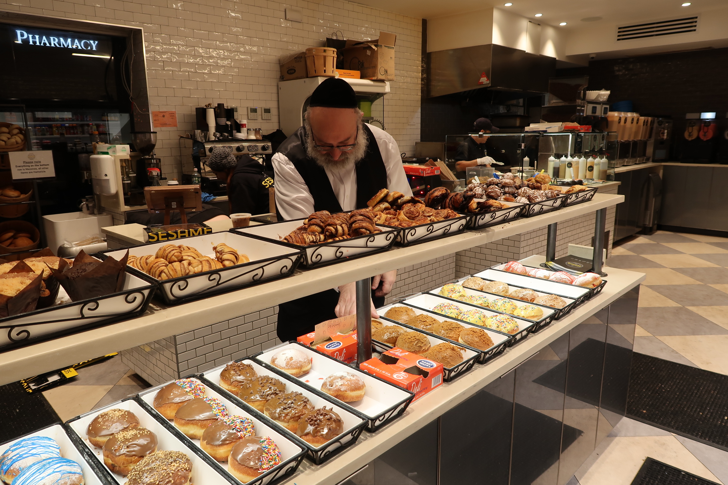 People Buying Doughnuts for Chanukah at the Famous Sesame Bakery on ...