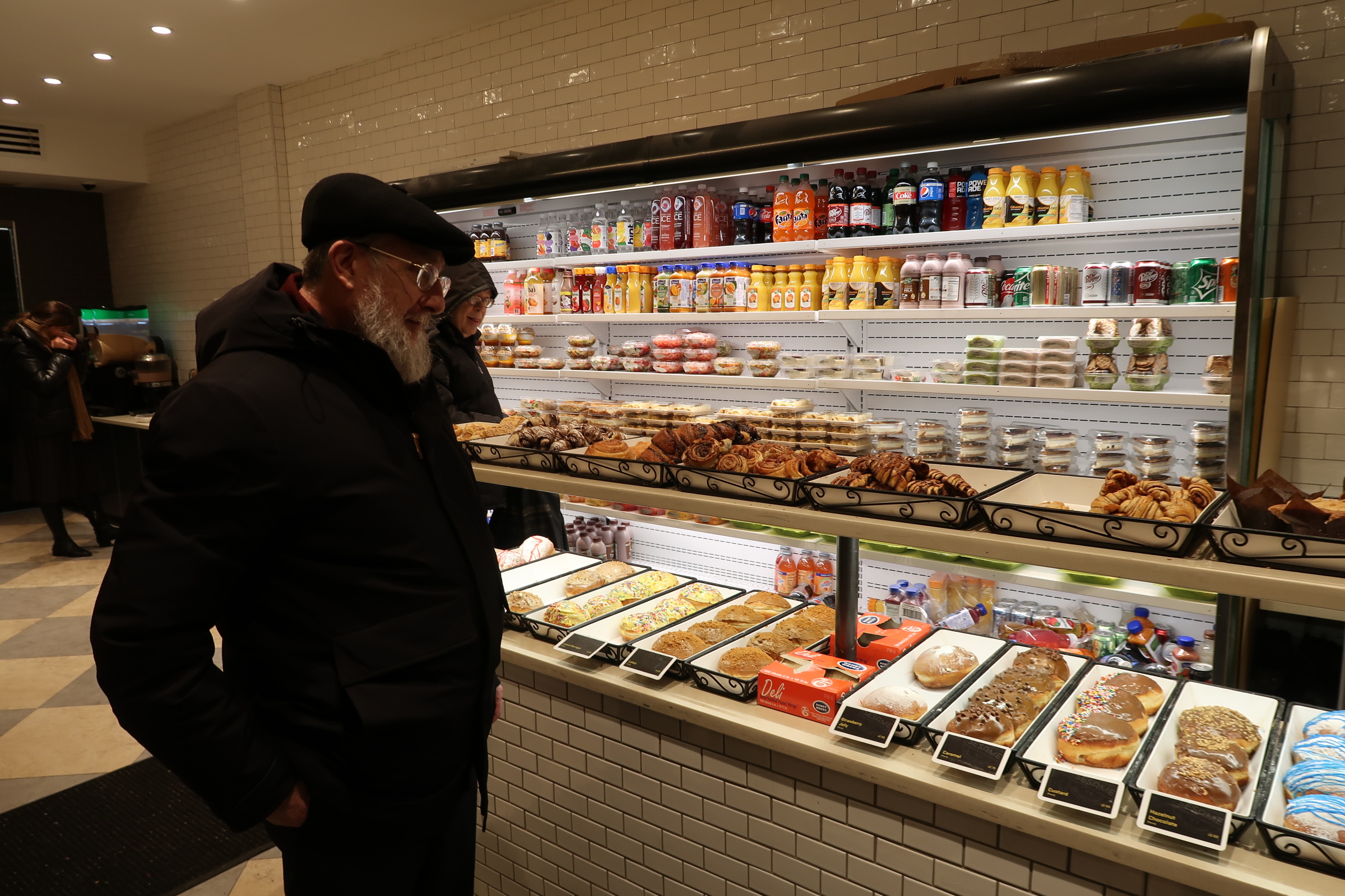 People Buying Doughnuts for Chanukah at the Famous Sesame Bakery on ...