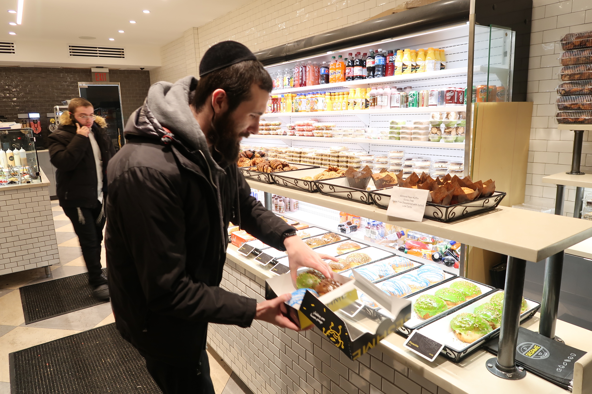 People Buying Doughnuts for Chanukah at the Famous Sesame Bakery on ...