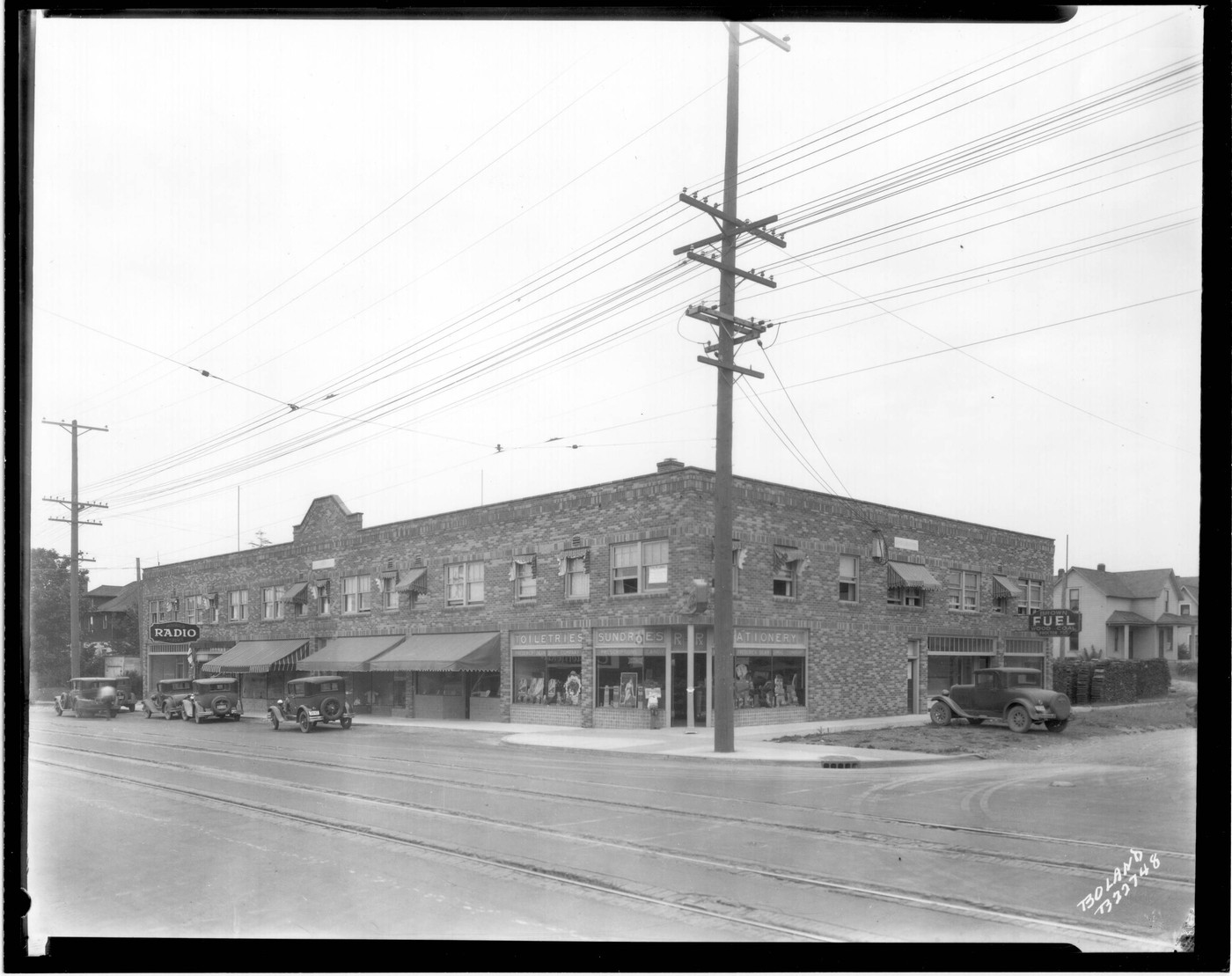 Gamble Building (1929): 2701-2707 N Proctor St - Clio