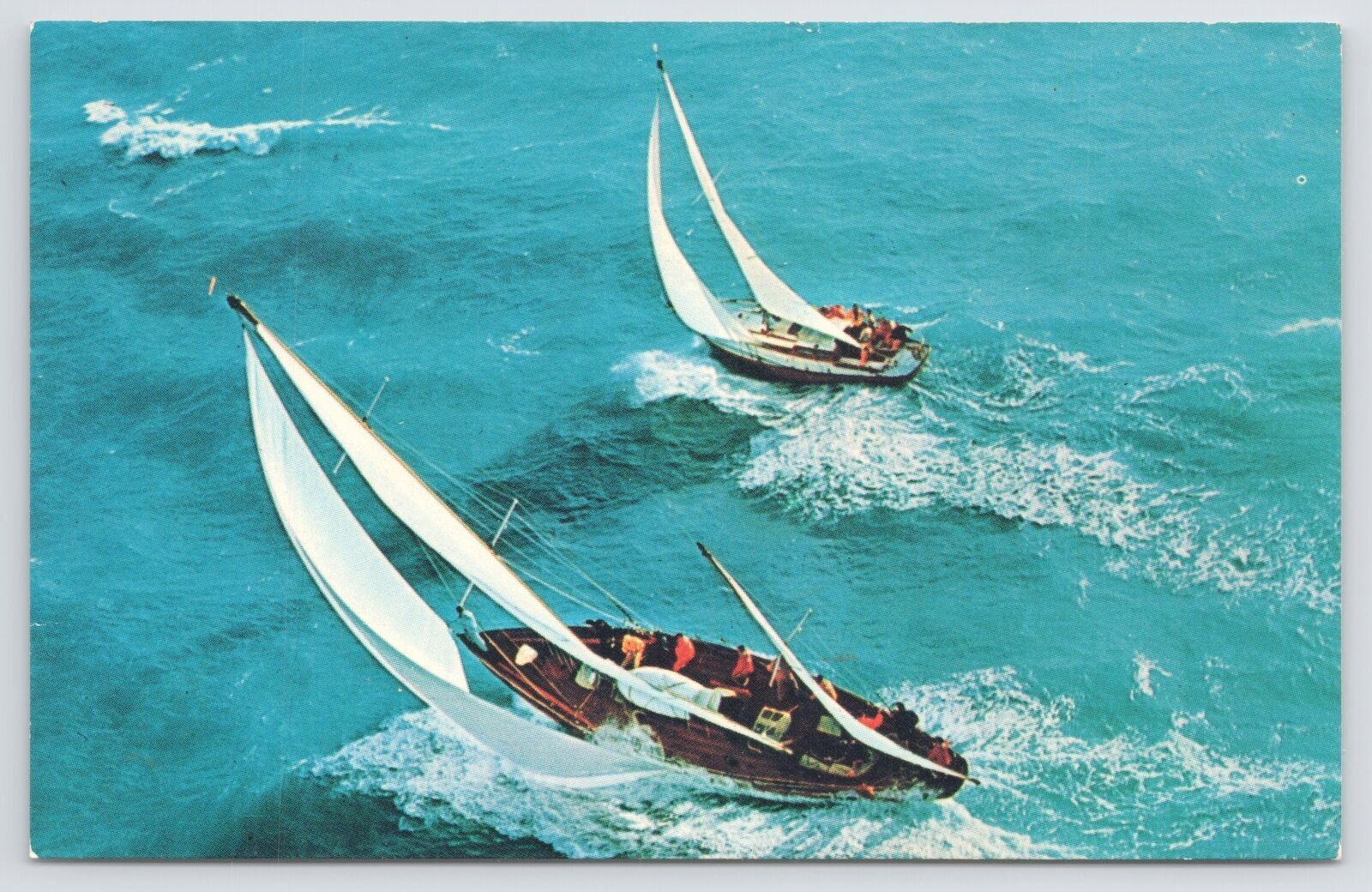 People Enjoying A Sunshine Day Out In Sailboats On The Oceans Water ...