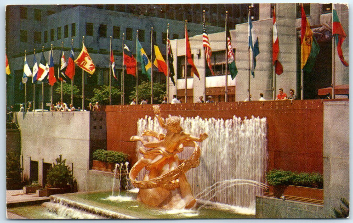 Prometheus Statue and Fountain in Rockefeller Plaza with Flags of the U ...