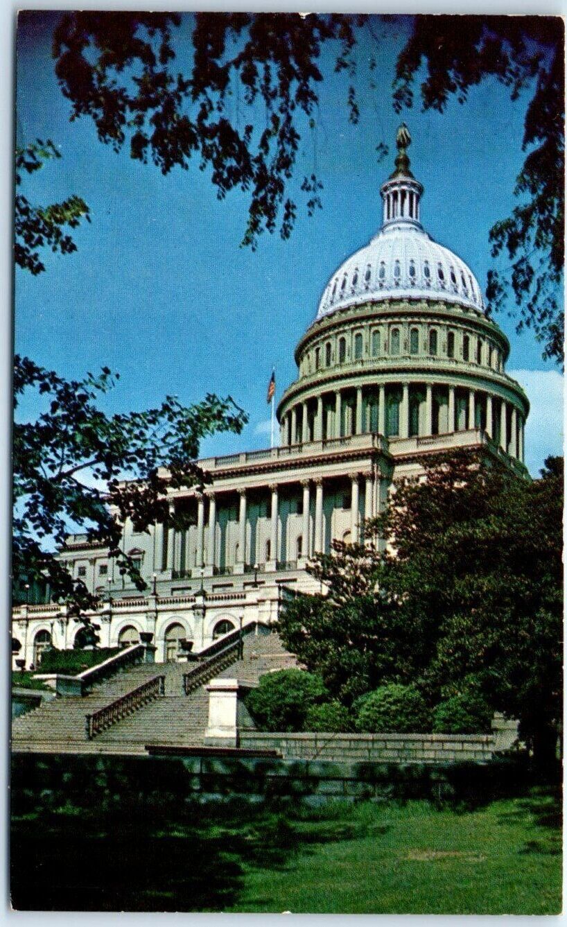 Surmounting The Impressive Dome Of The Capitol Building At Washington ...