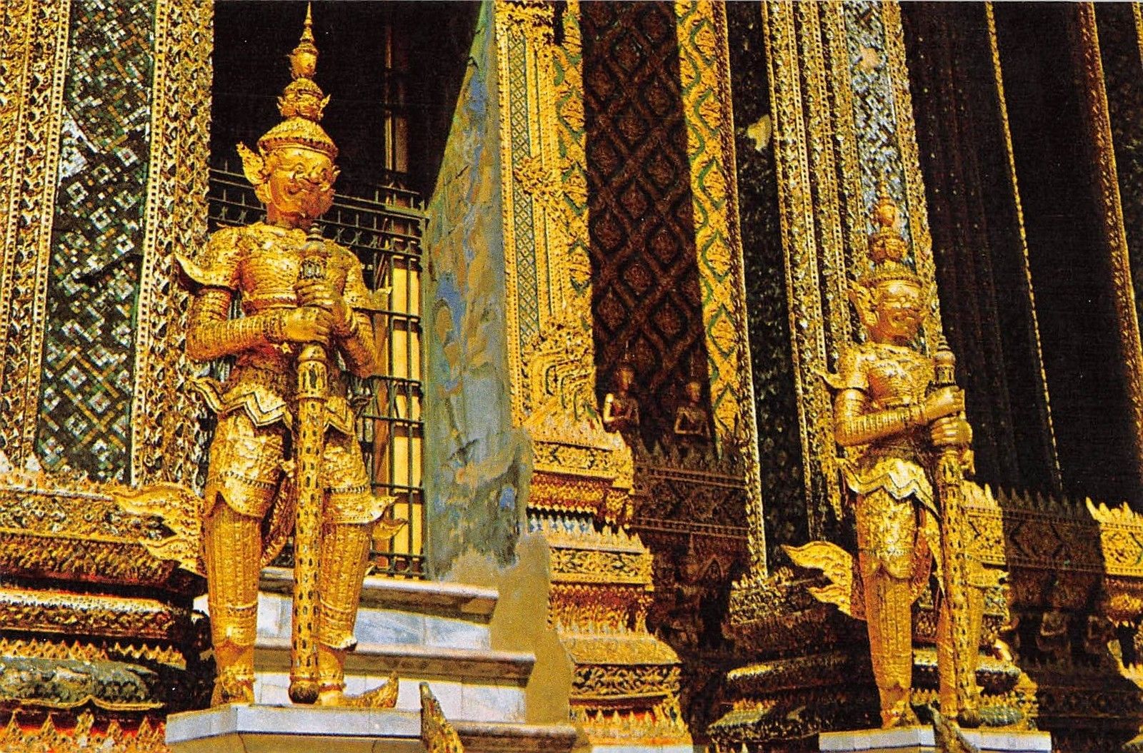 BT12093 Two gilded mental giant masked gods guard the passage to ...