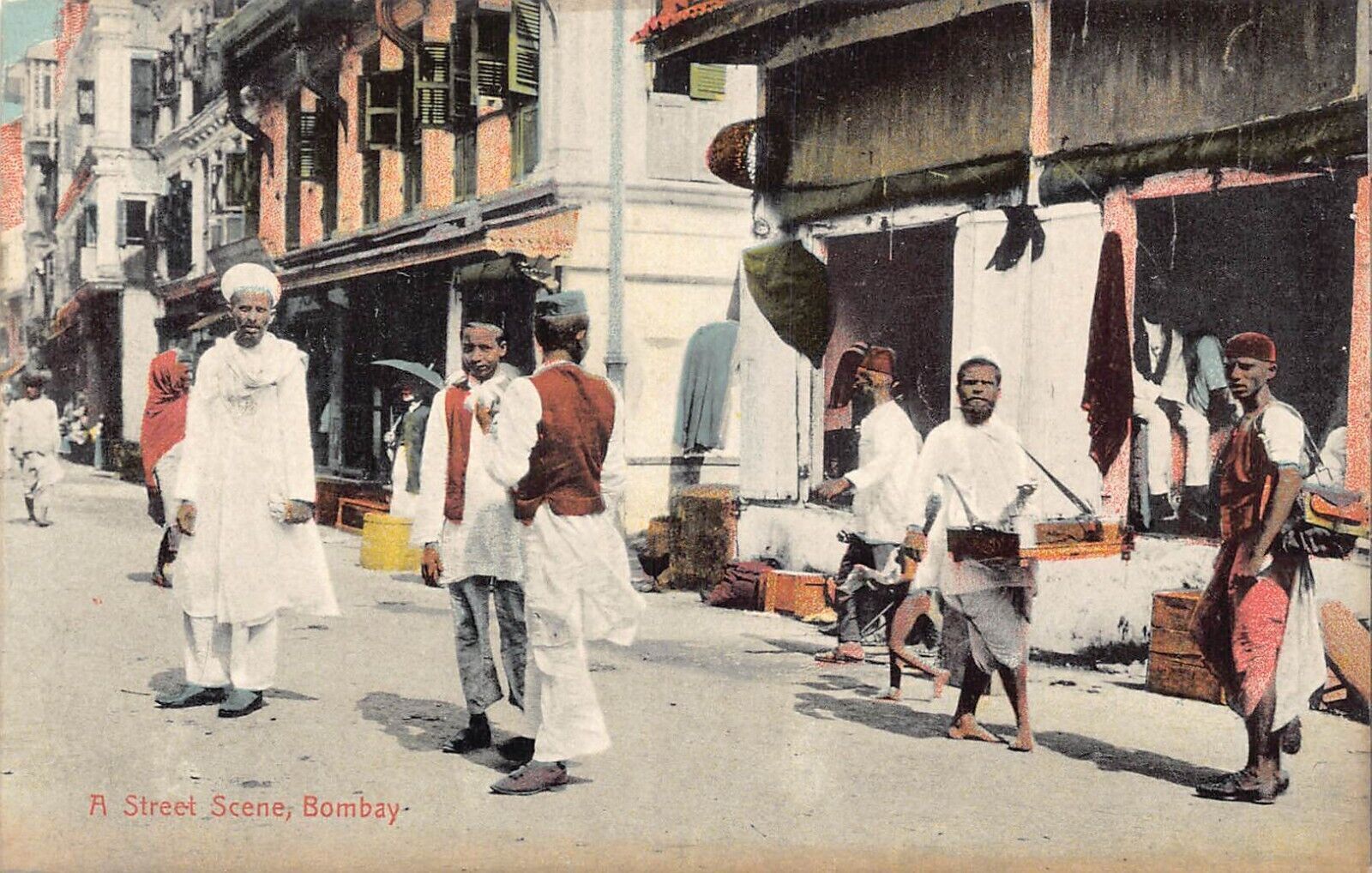 L378 India A street scene Bombay men in traditional costumes trade ...