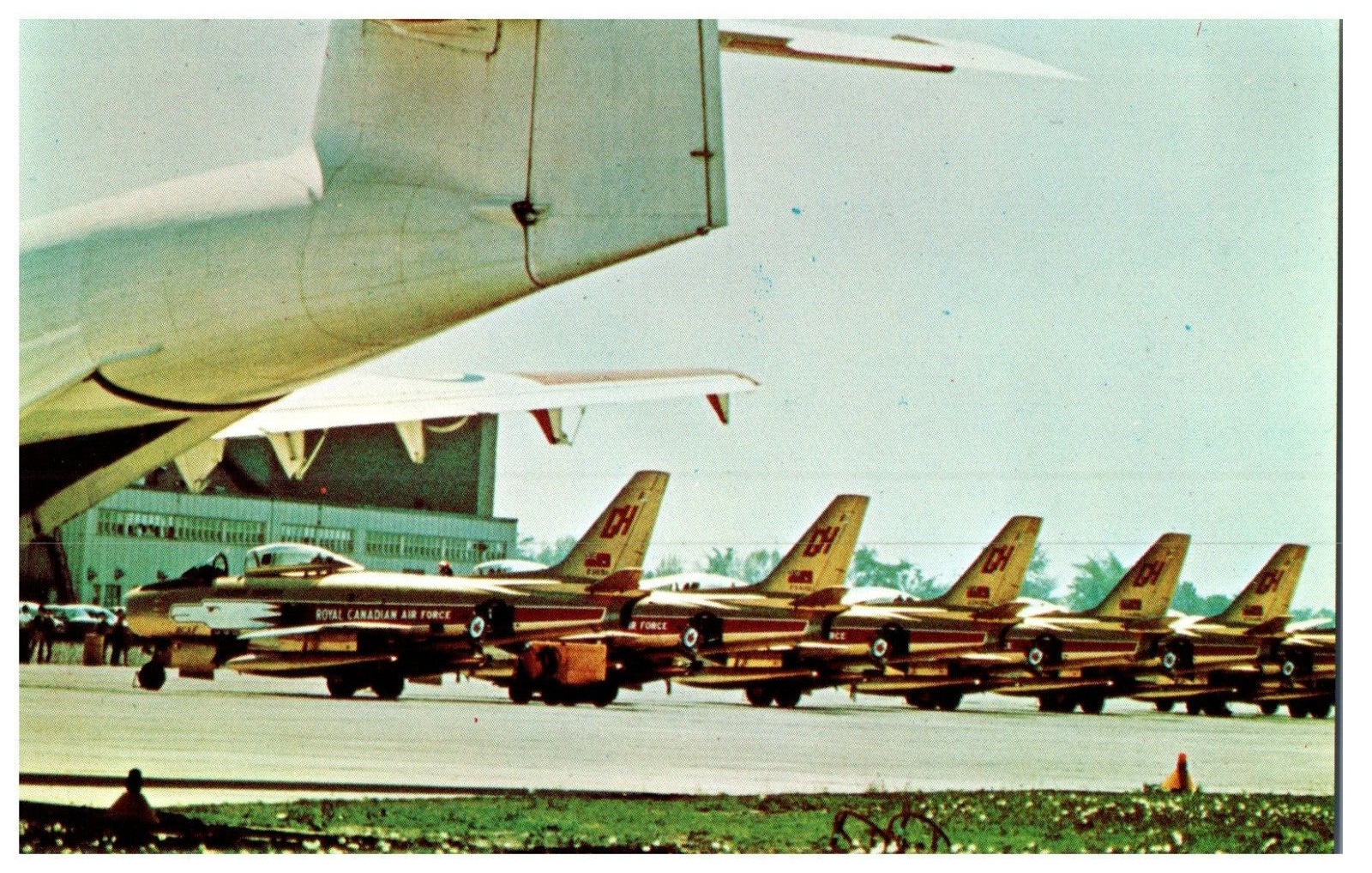 RCAF Day in Canada Golden Hawks line up behind tail of Caribou Airplane ...