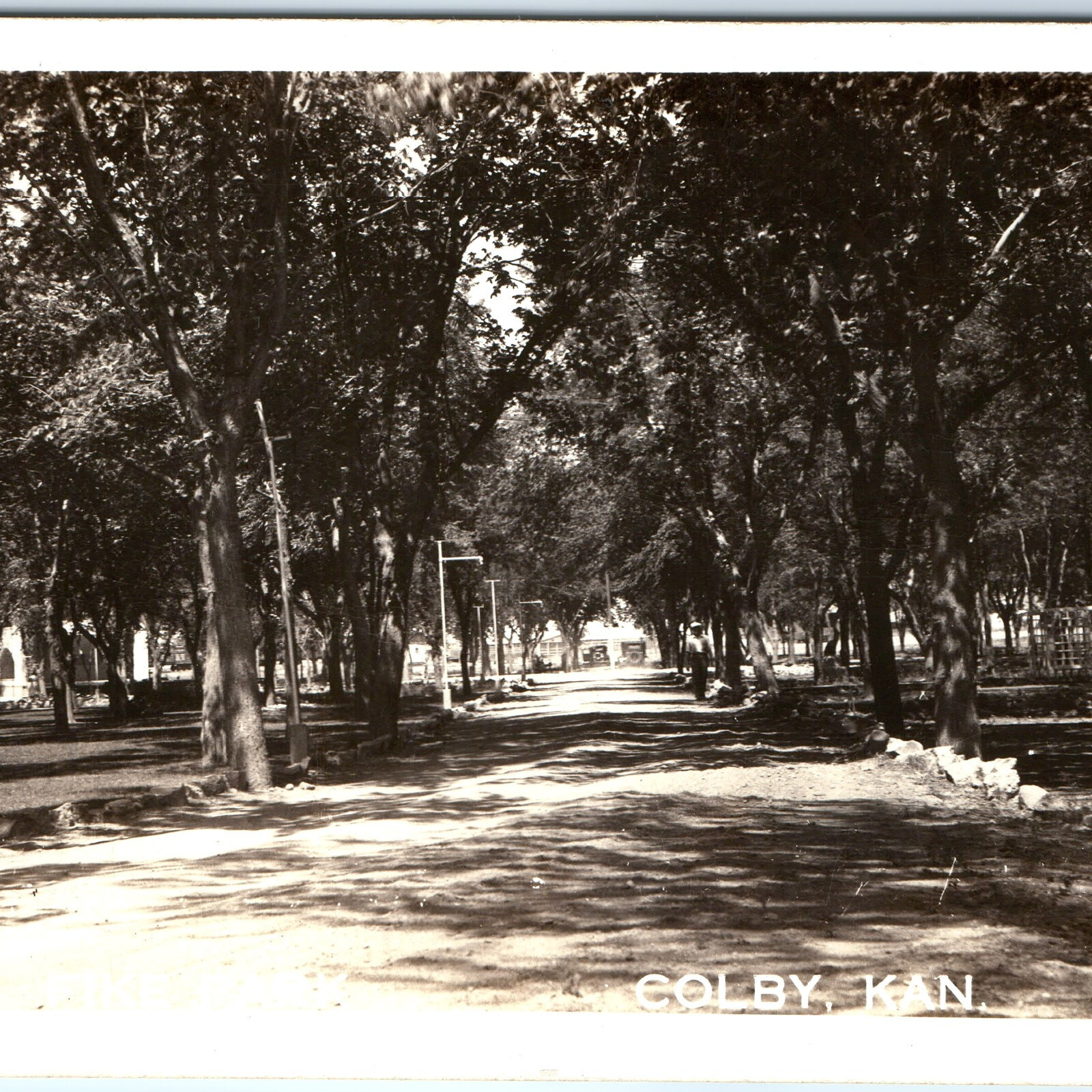c1940s Colby, KS RPPC Fike Park Postcard Trucks Tree Path Shaded Road ...