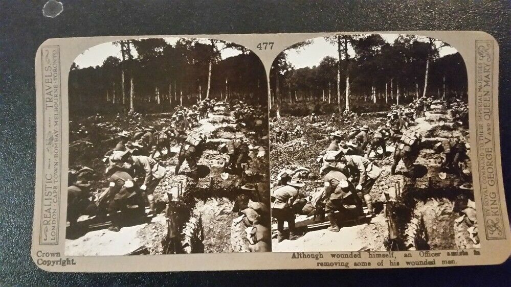 WWI, Wounded himself and Officer assists on removing some of the ...
